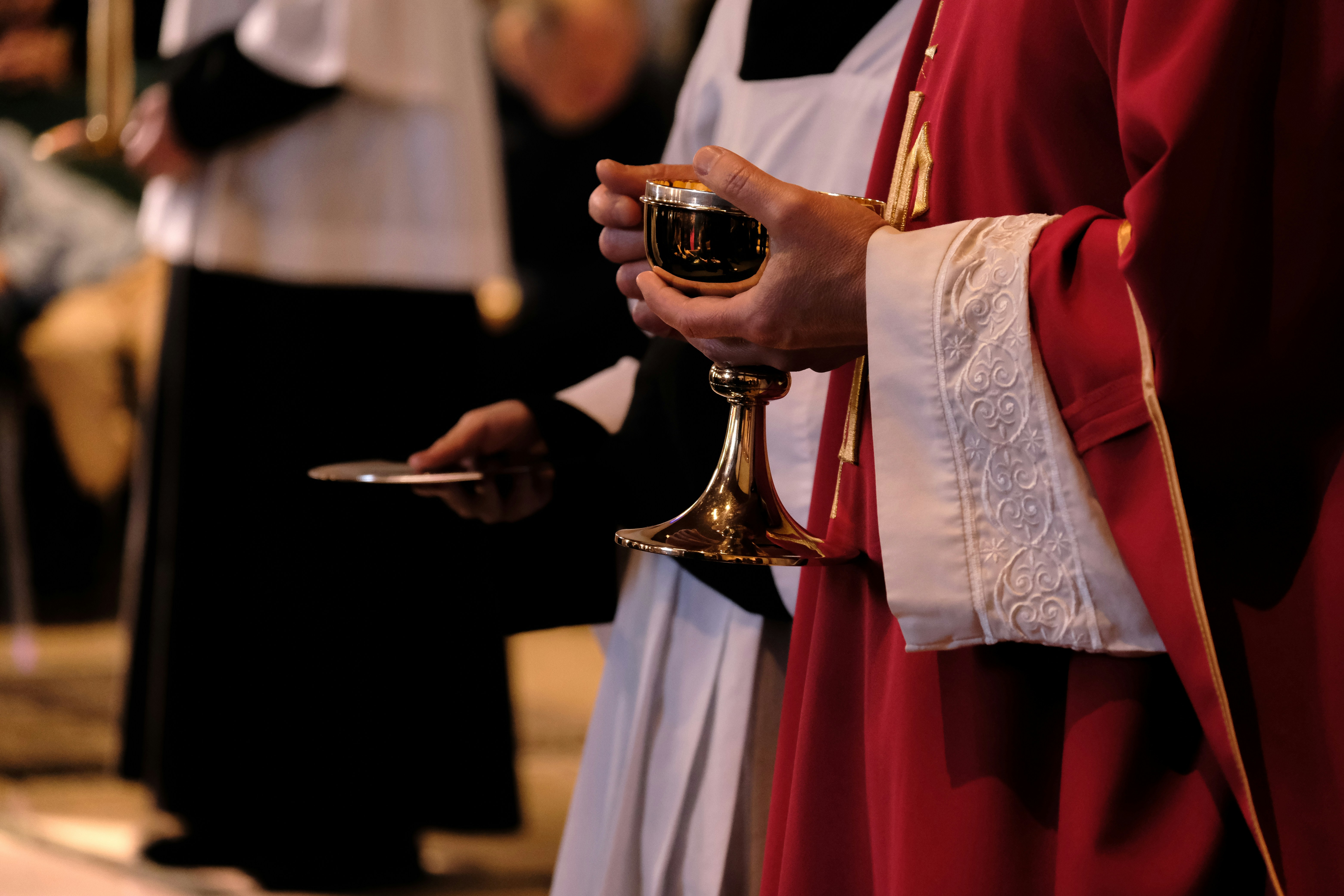 A priest is holding a chalice in a church photo – Free Jesus christ ...