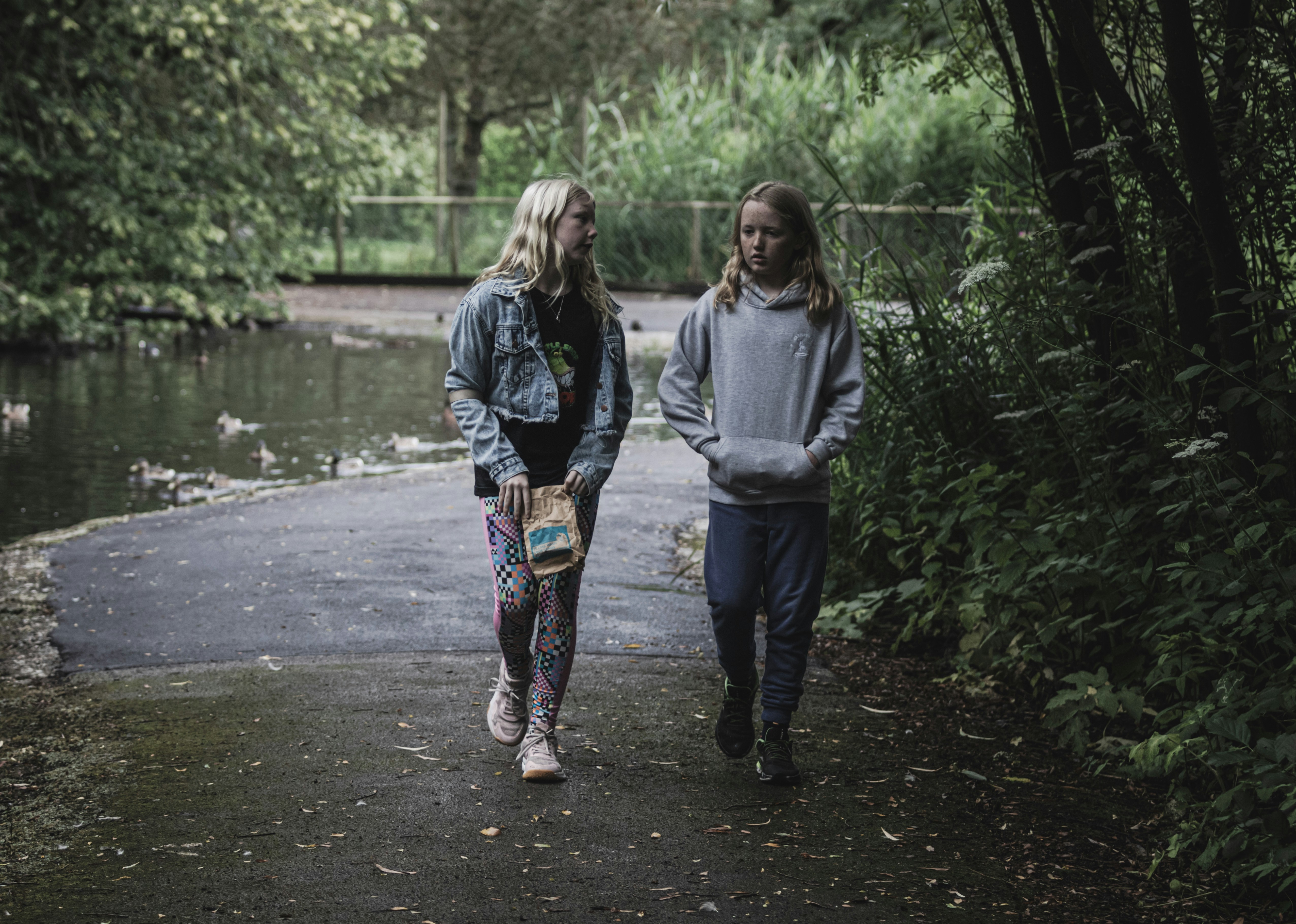 Siblings' Stroll by the Pond