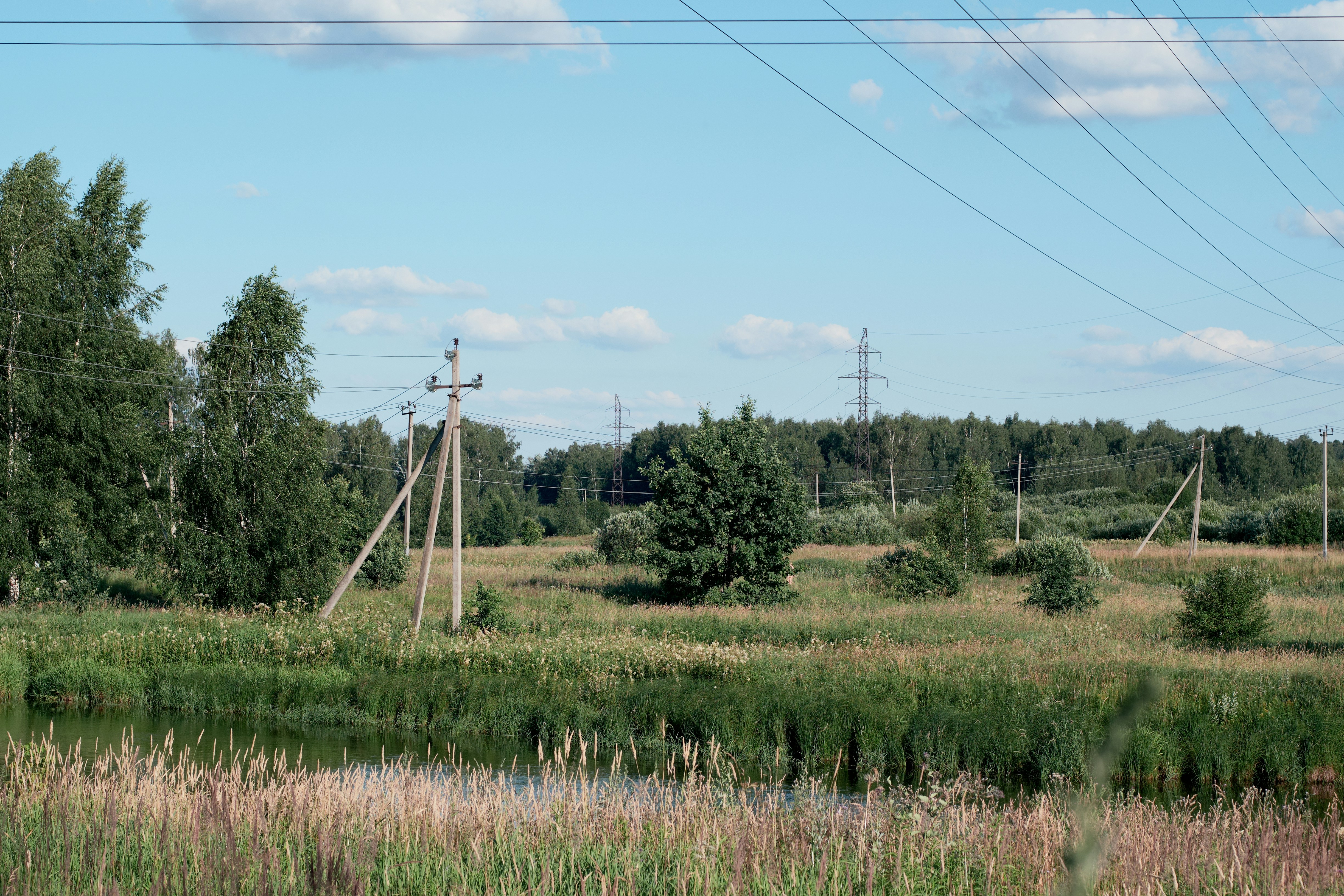 Tilted Power Lines Framing a Quiet Prairie Horizon