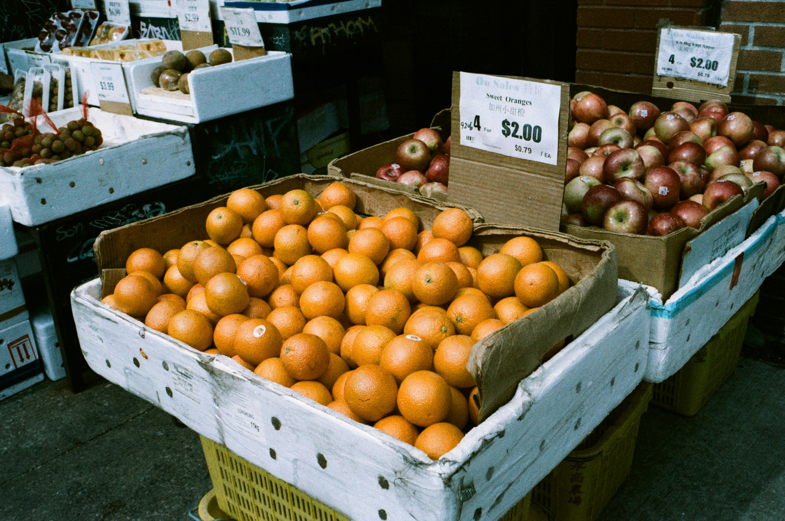 Boxes of oranges and apples are on display photo – Free Toronto Image ...