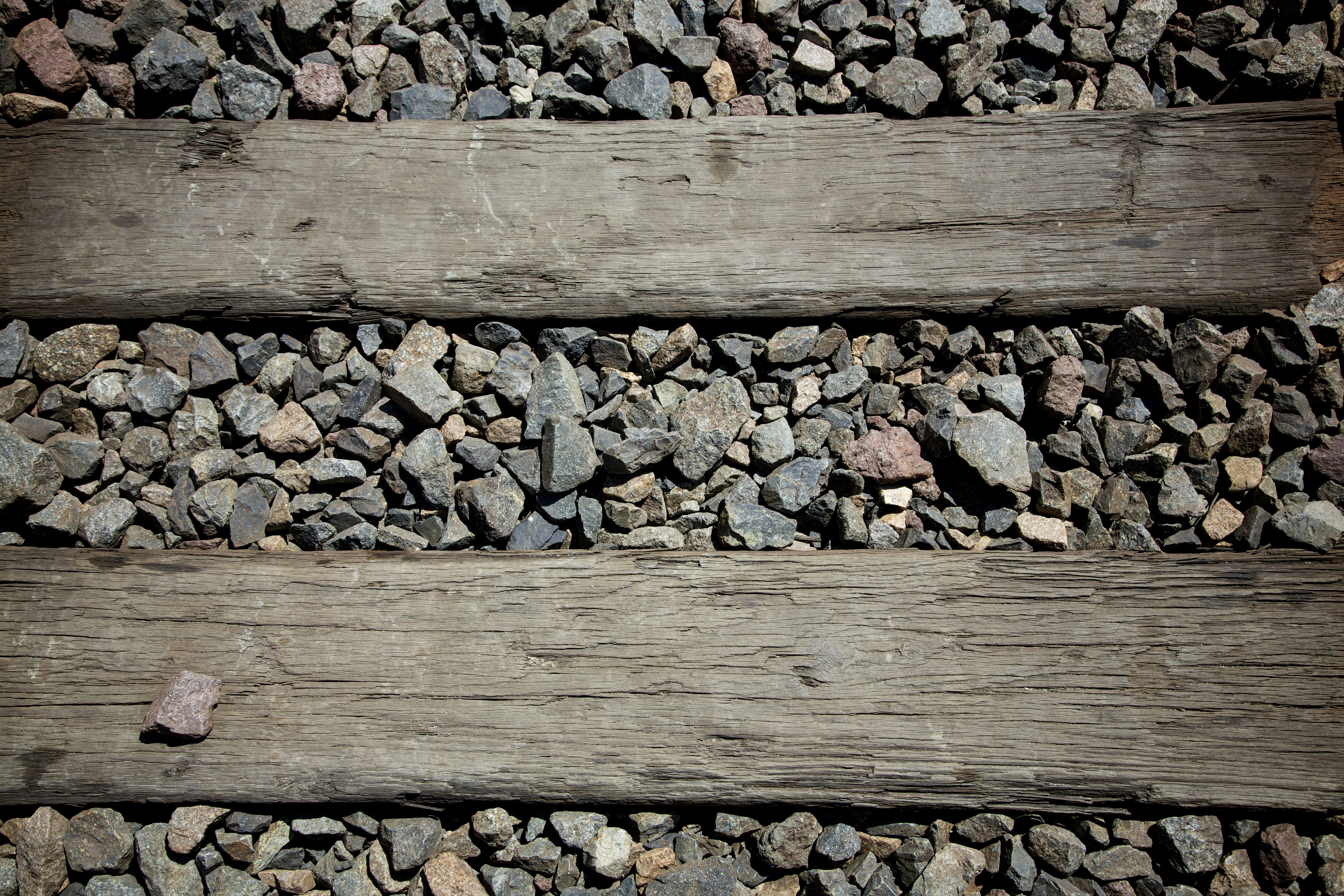 Between the Rails: Quiet Geometry of Timber and Gravel