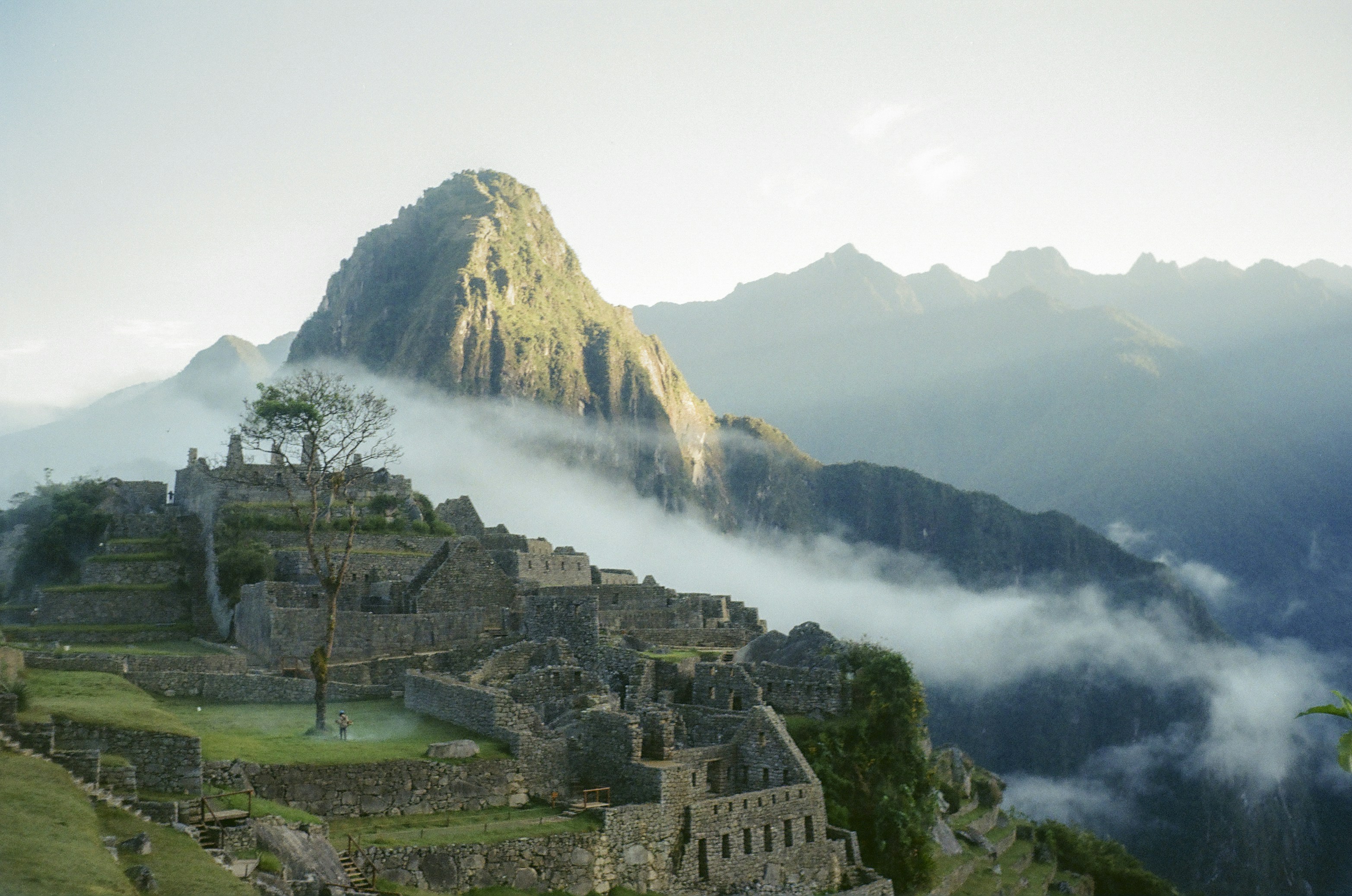 A view of a mountain with a castle in the foreground photo – Free Machu ...