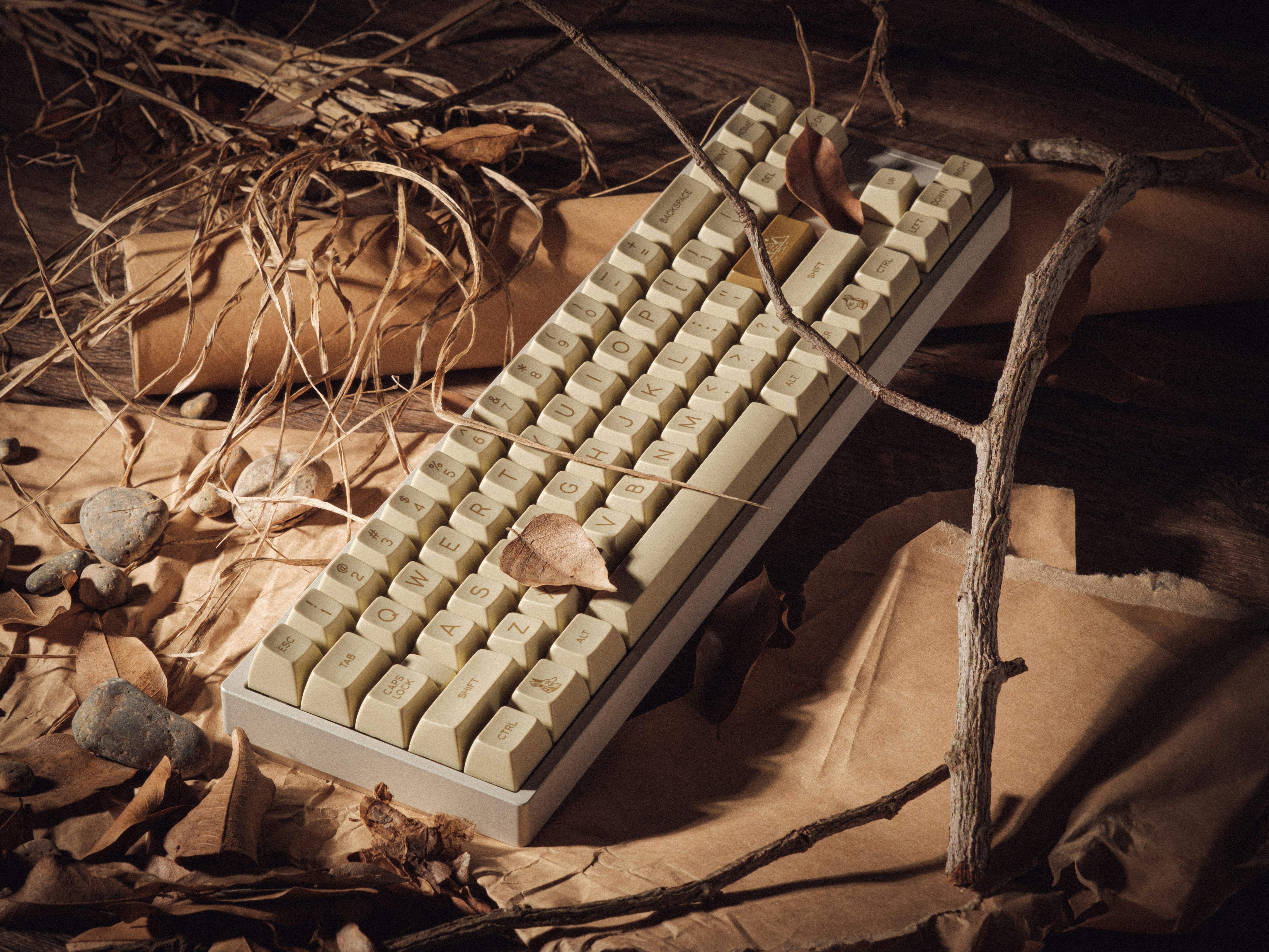 A computer keyboard sitting on top of a pile of leaves photo – Free ...