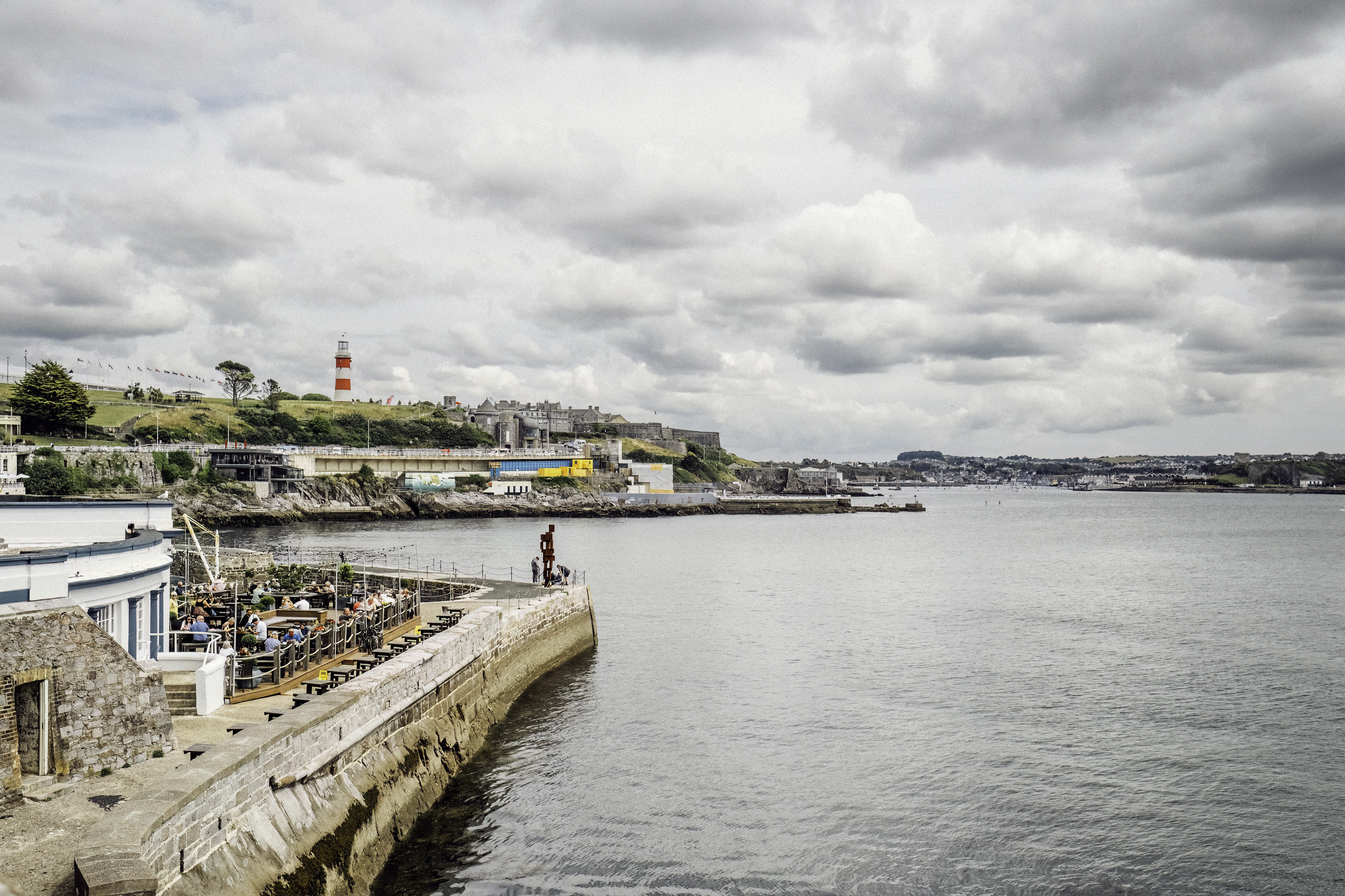 A large body of water next to a small town photo – Free Plymouth Image ...