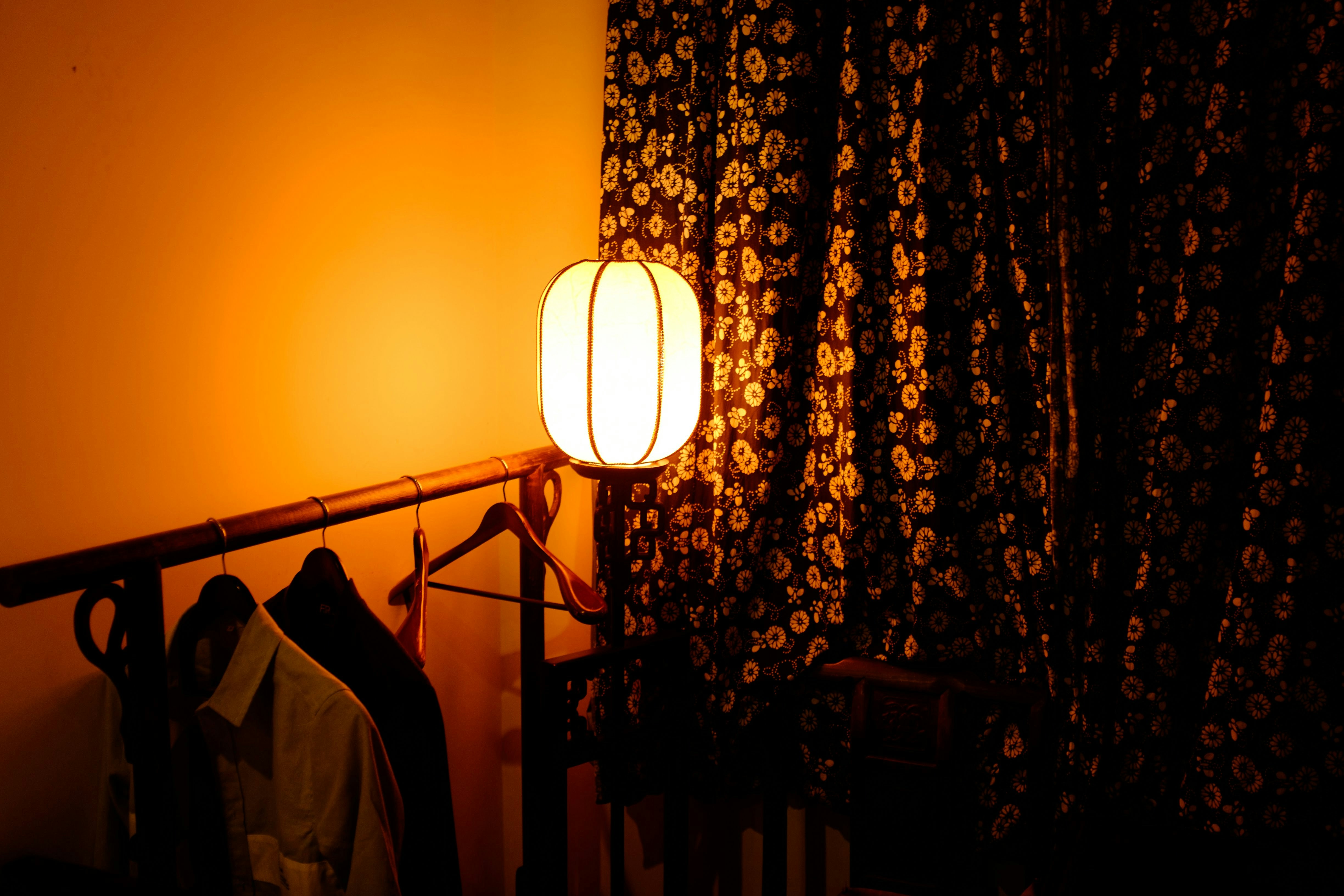Lantern Glow Over a Quiet Wardrobe Corner