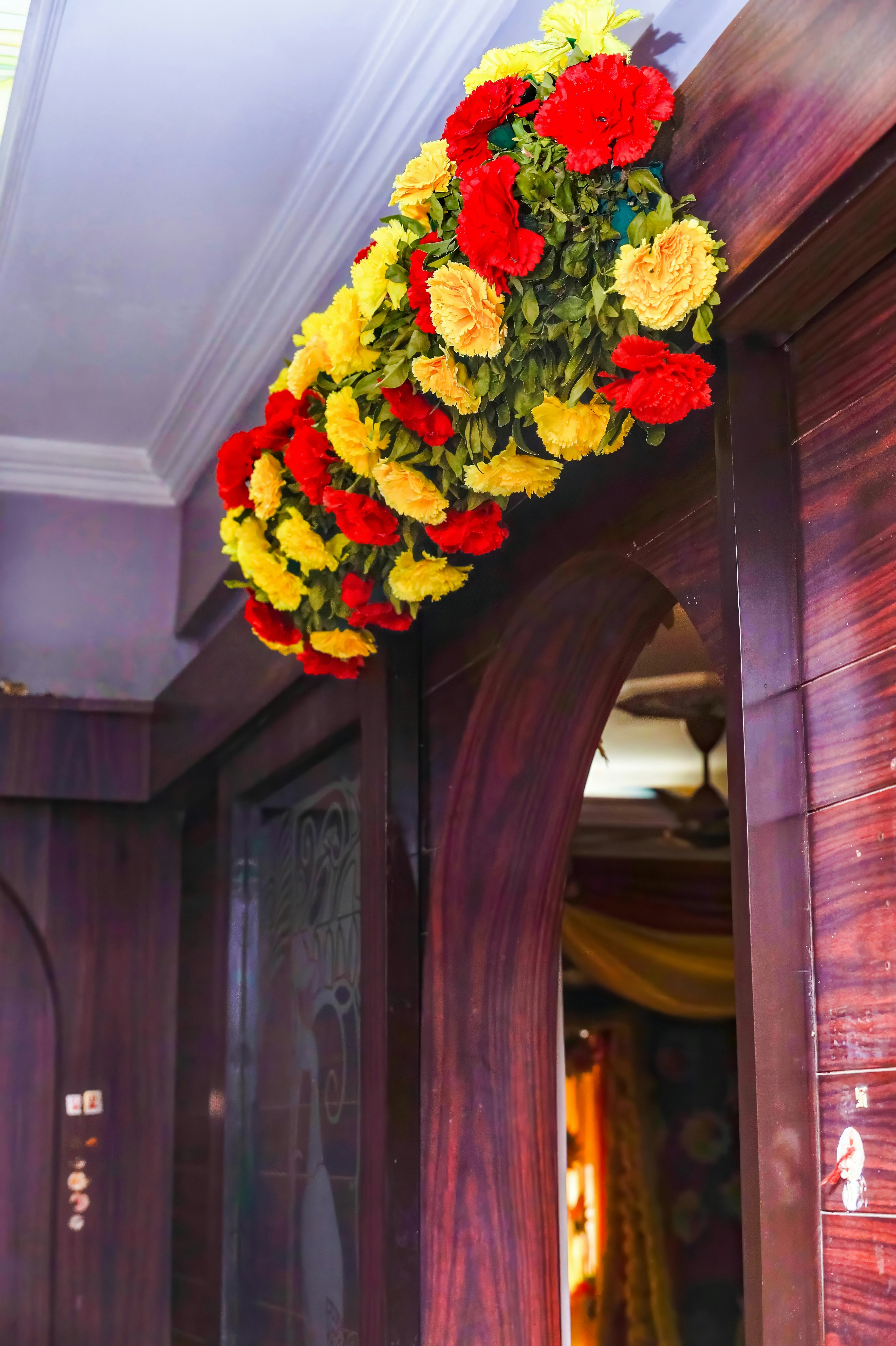 Floral Crown Over a Mahogany Archway Framing a Doorway