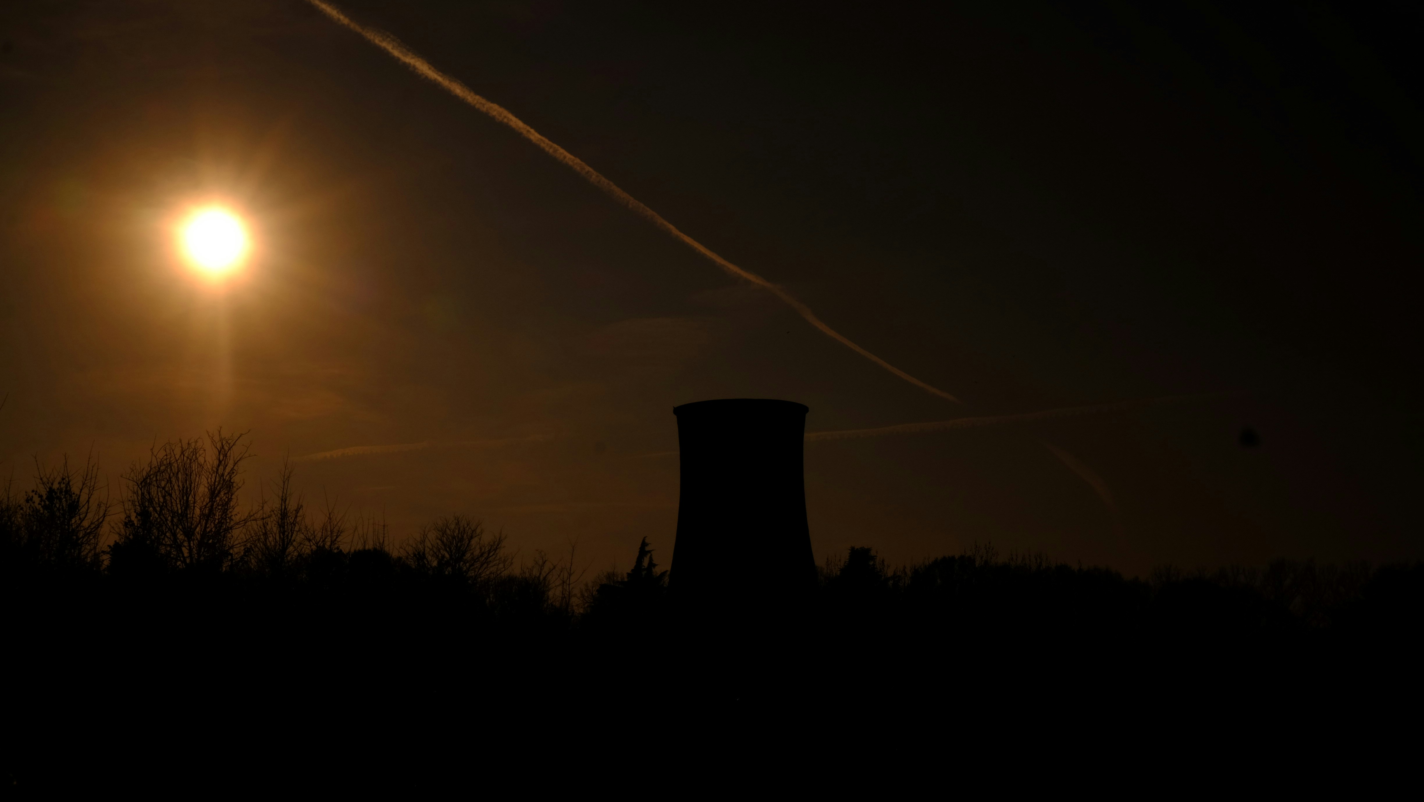Silhouette and Sun: A Nuclear Plant Silhouette at Dusk