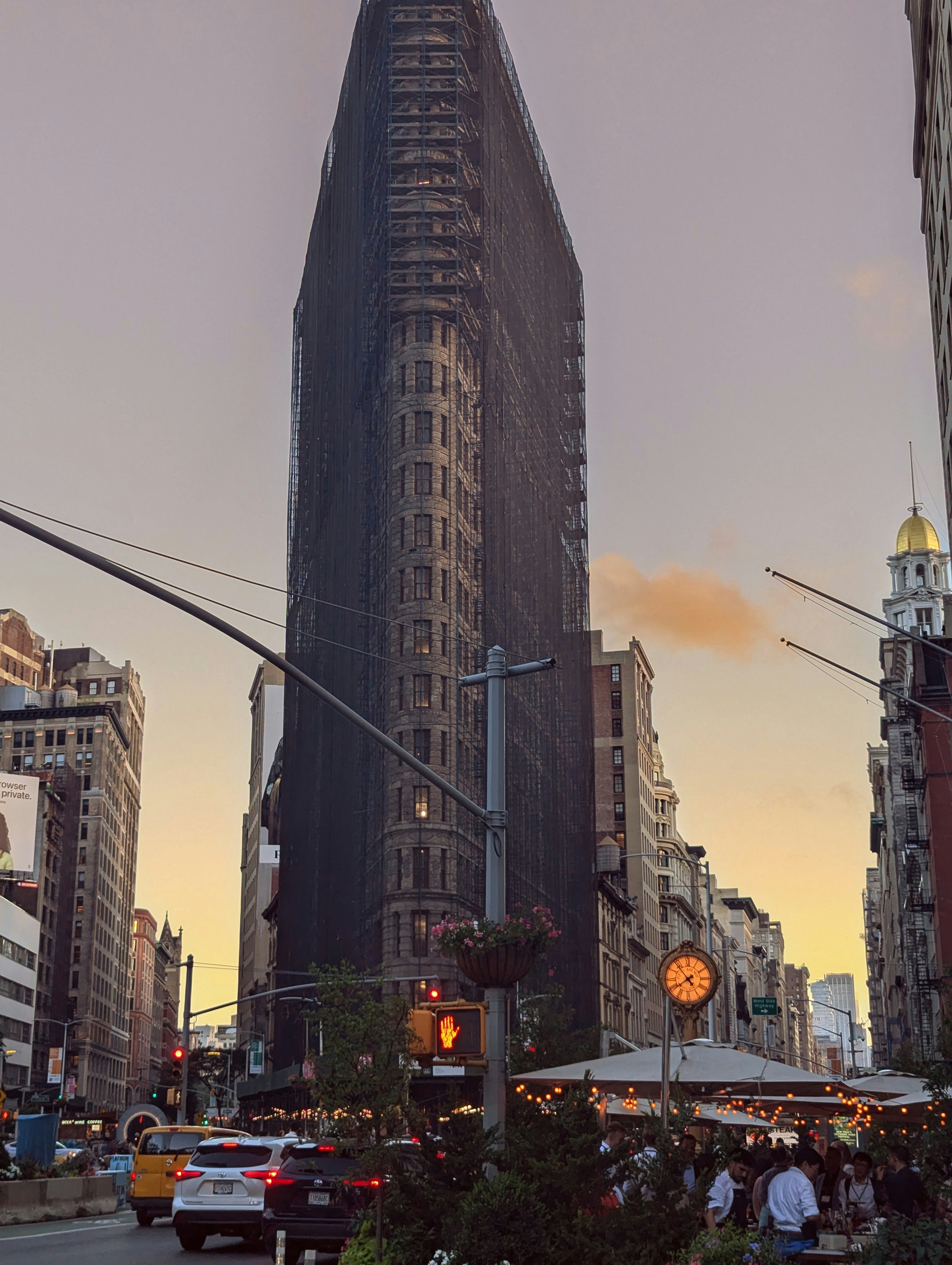 A tall building towering over a city filled with tall buildings photo ...