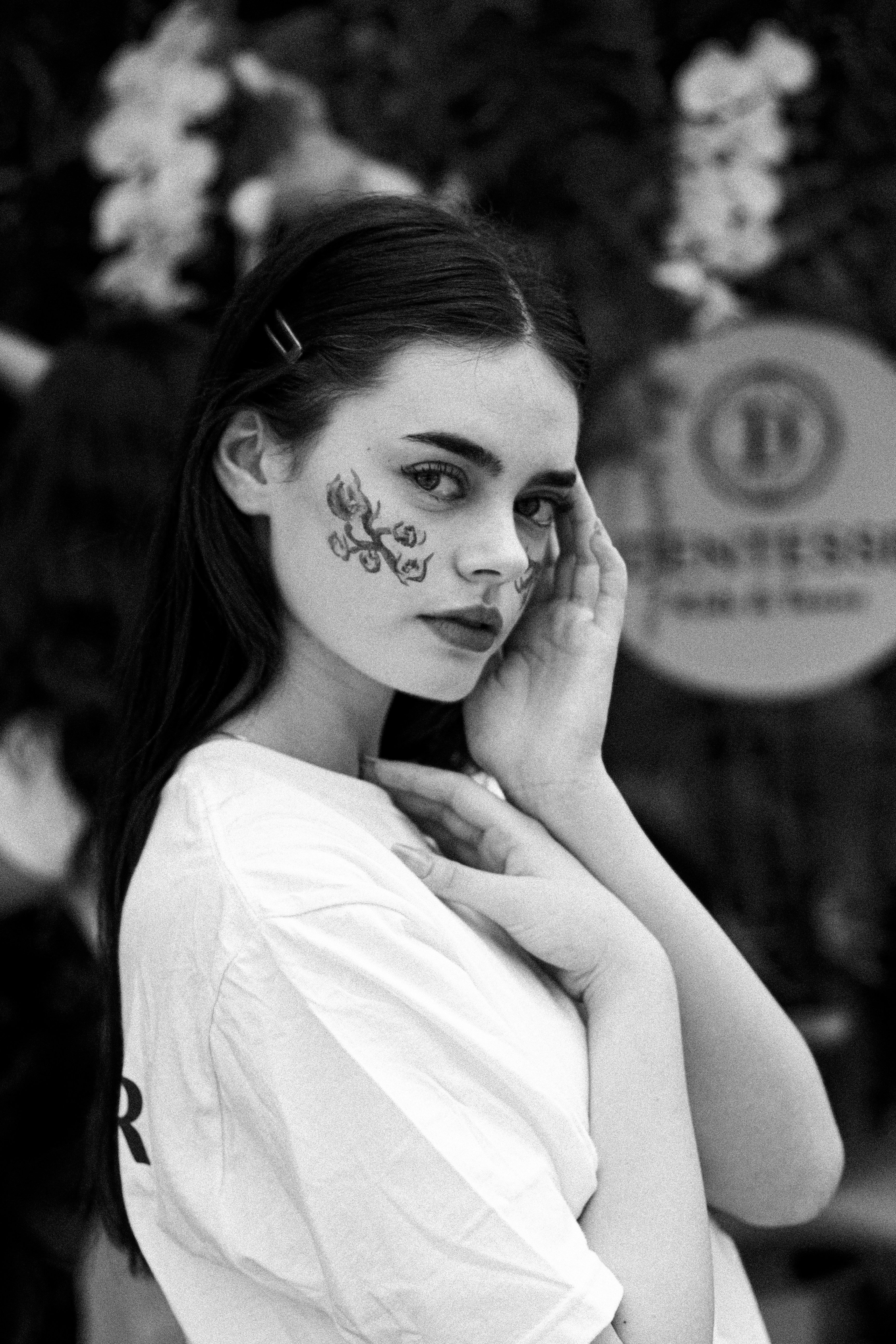 Floral Gaze: Mono Portrait with a Cheek Tattoo