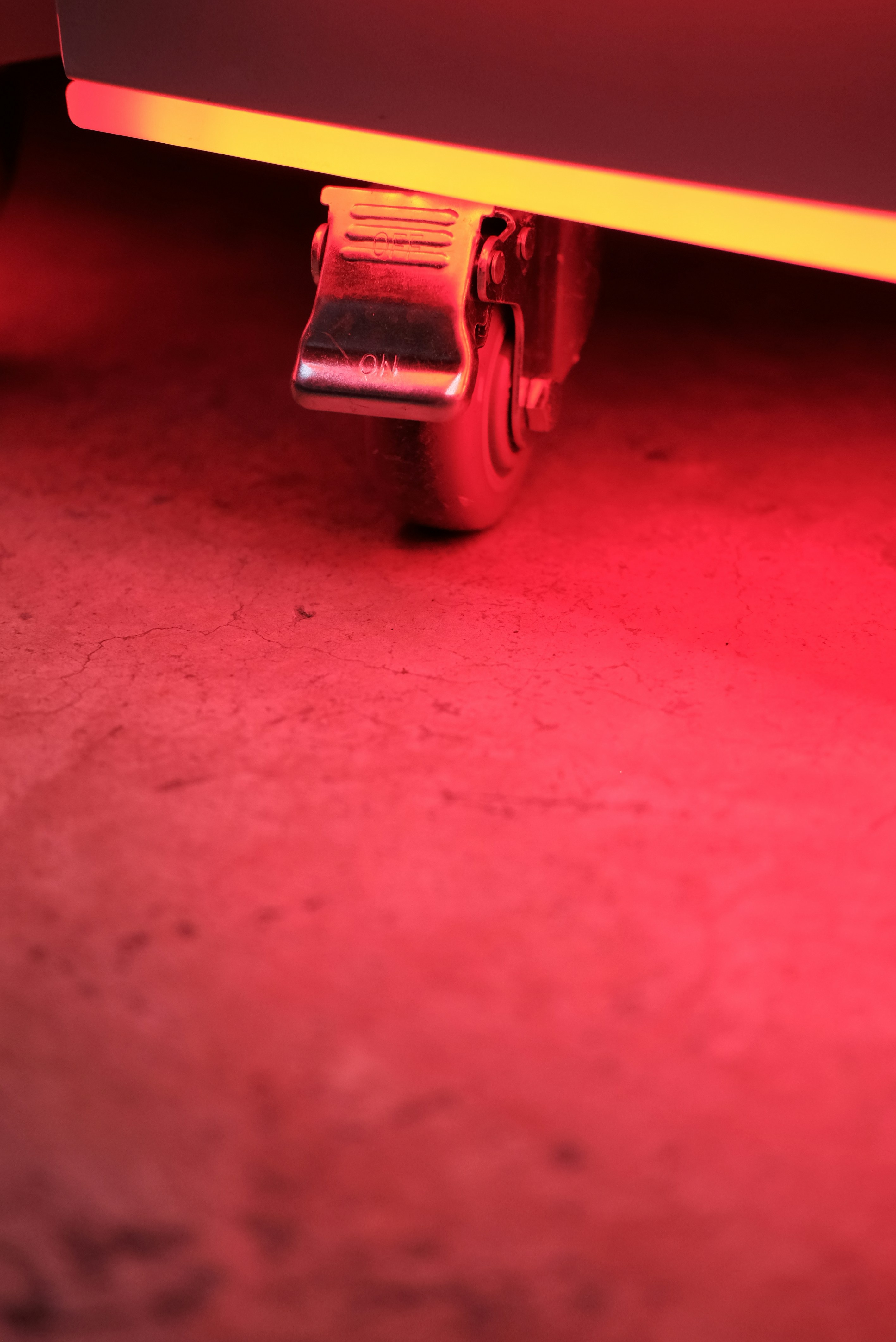 A locked wheel illuminated by neon light