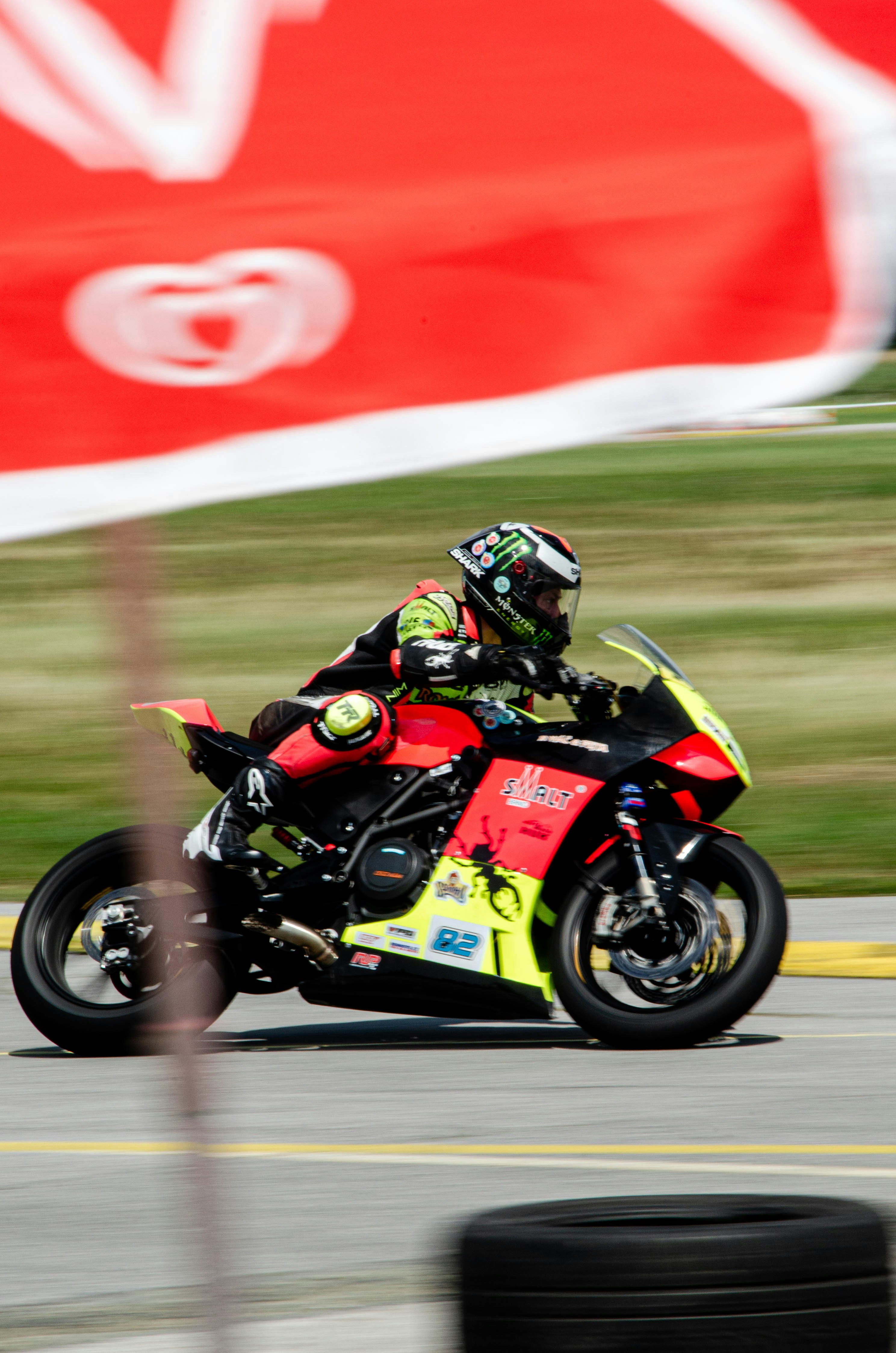 A person riding a motorcycle on a race track photo – Free Motorbikes ...