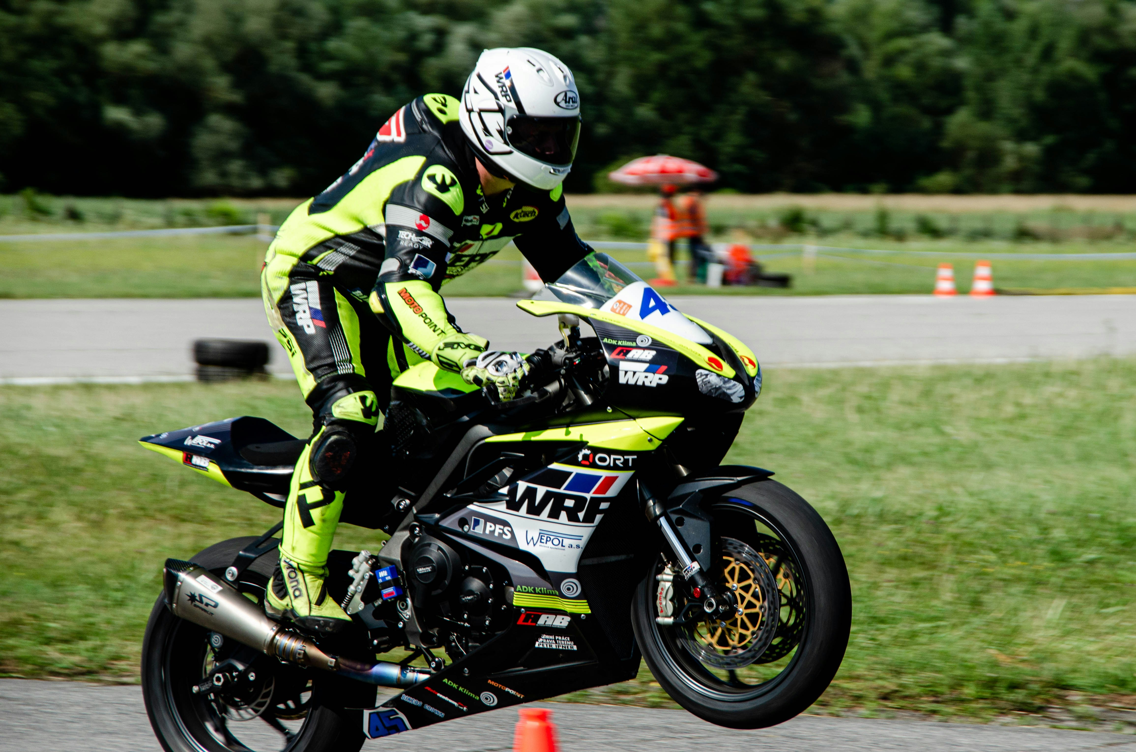 A person on a motorcycle doing a trick photo – Free Ducati Image on ...