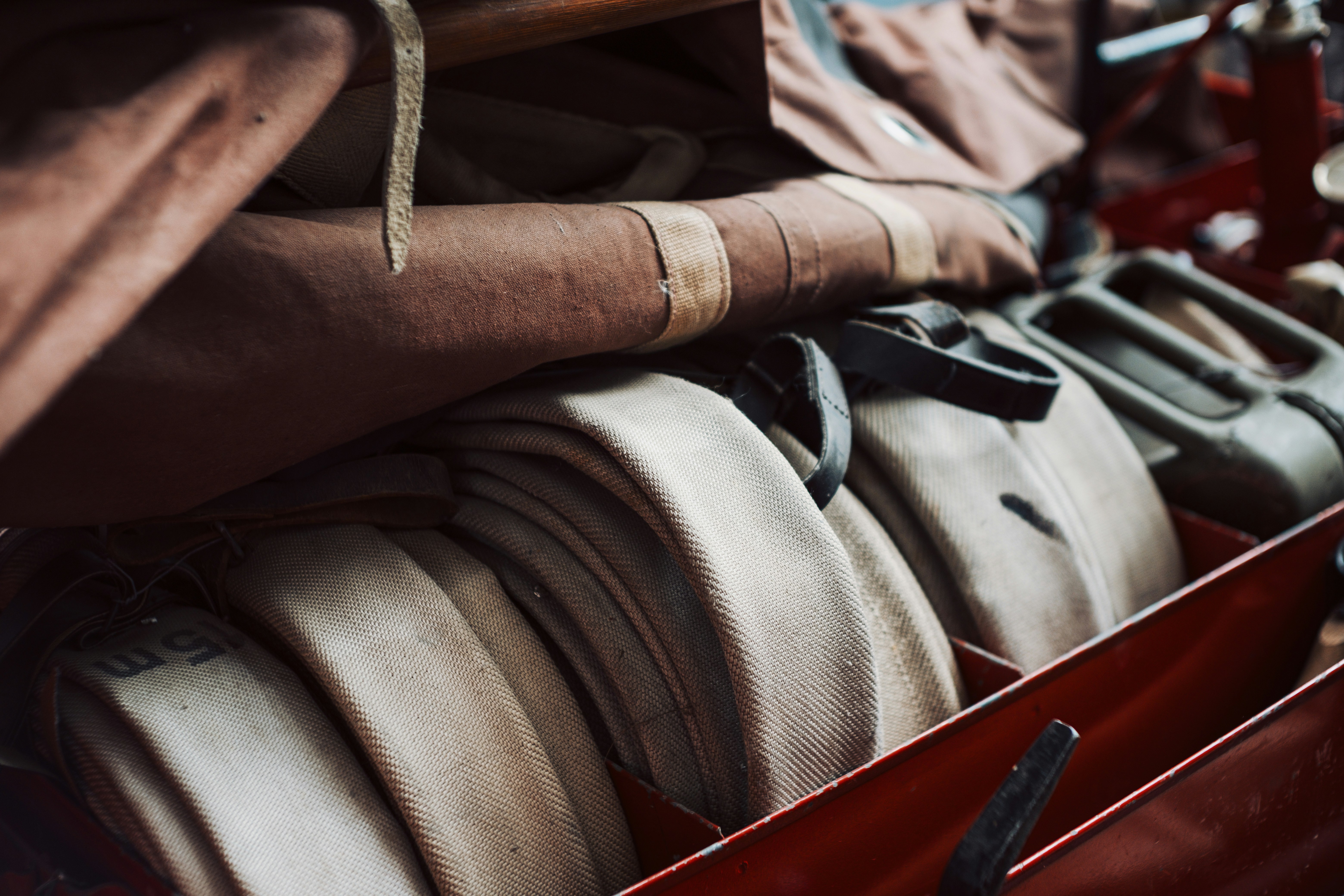 A bunch of clothes that are sitting on a shelf photo – Free Grey Image ...