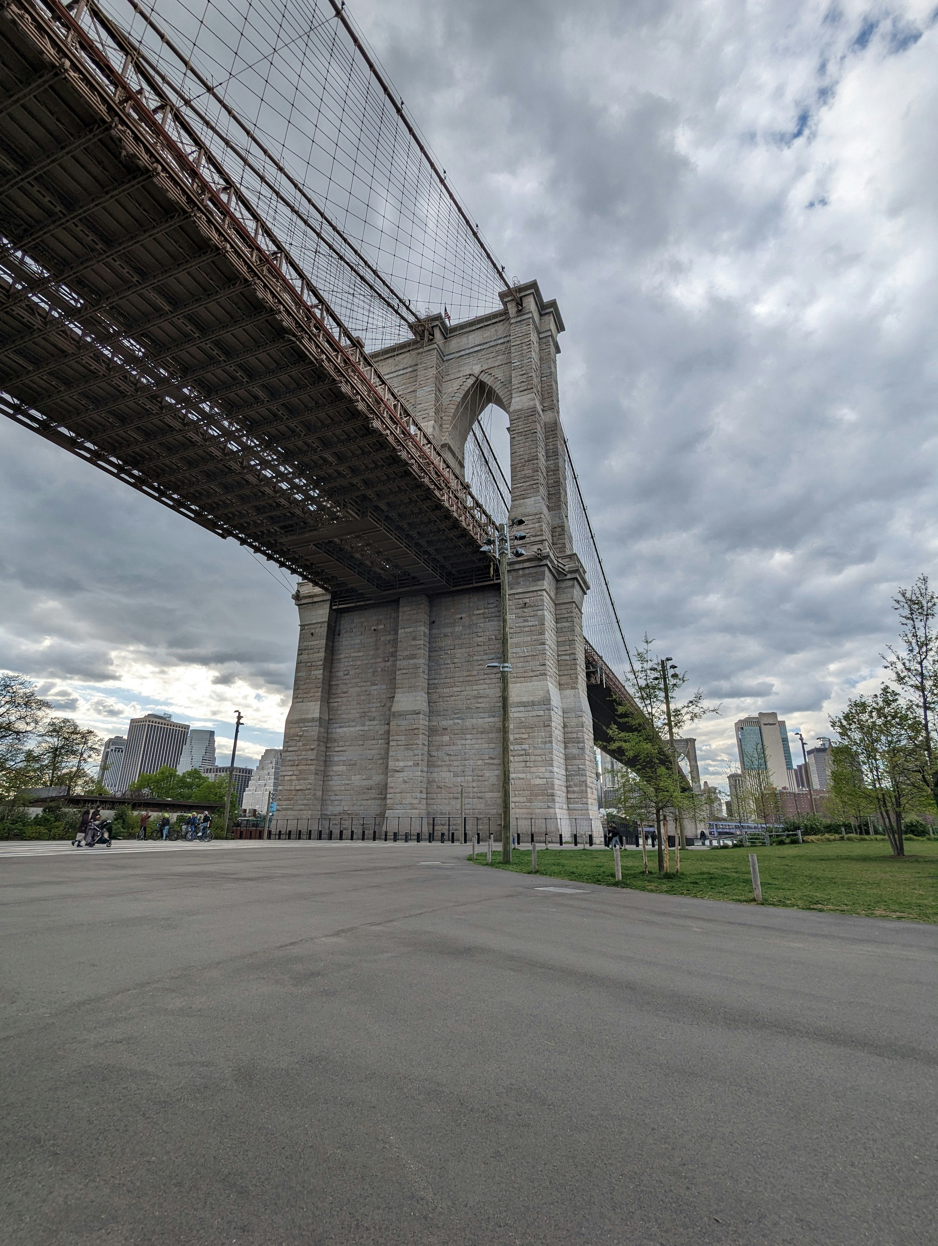 Stone Bridge Tower Framing a Cloudy Cityscape