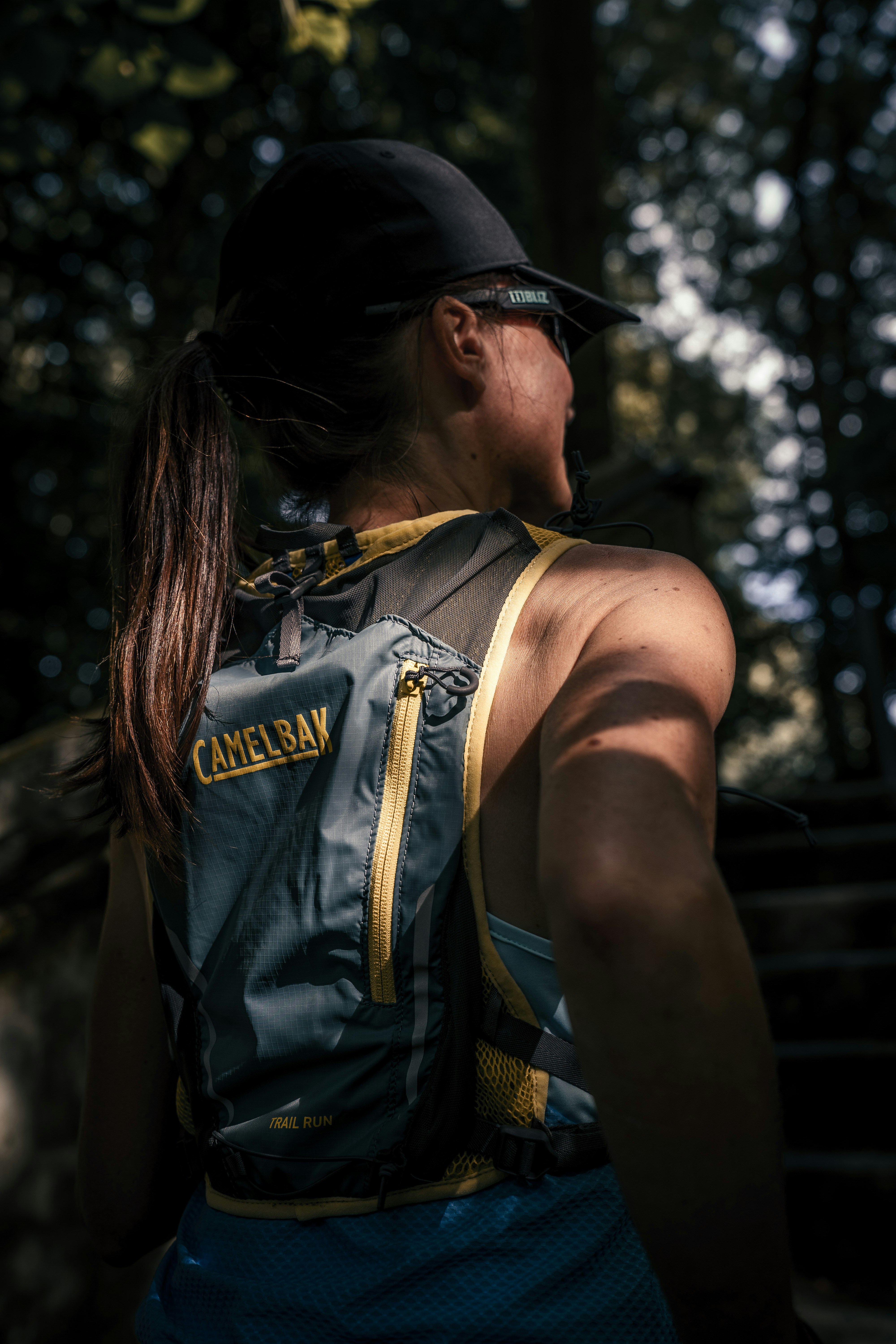 CamelBak in Dappled Light: Trail Runner's Back to the Forest