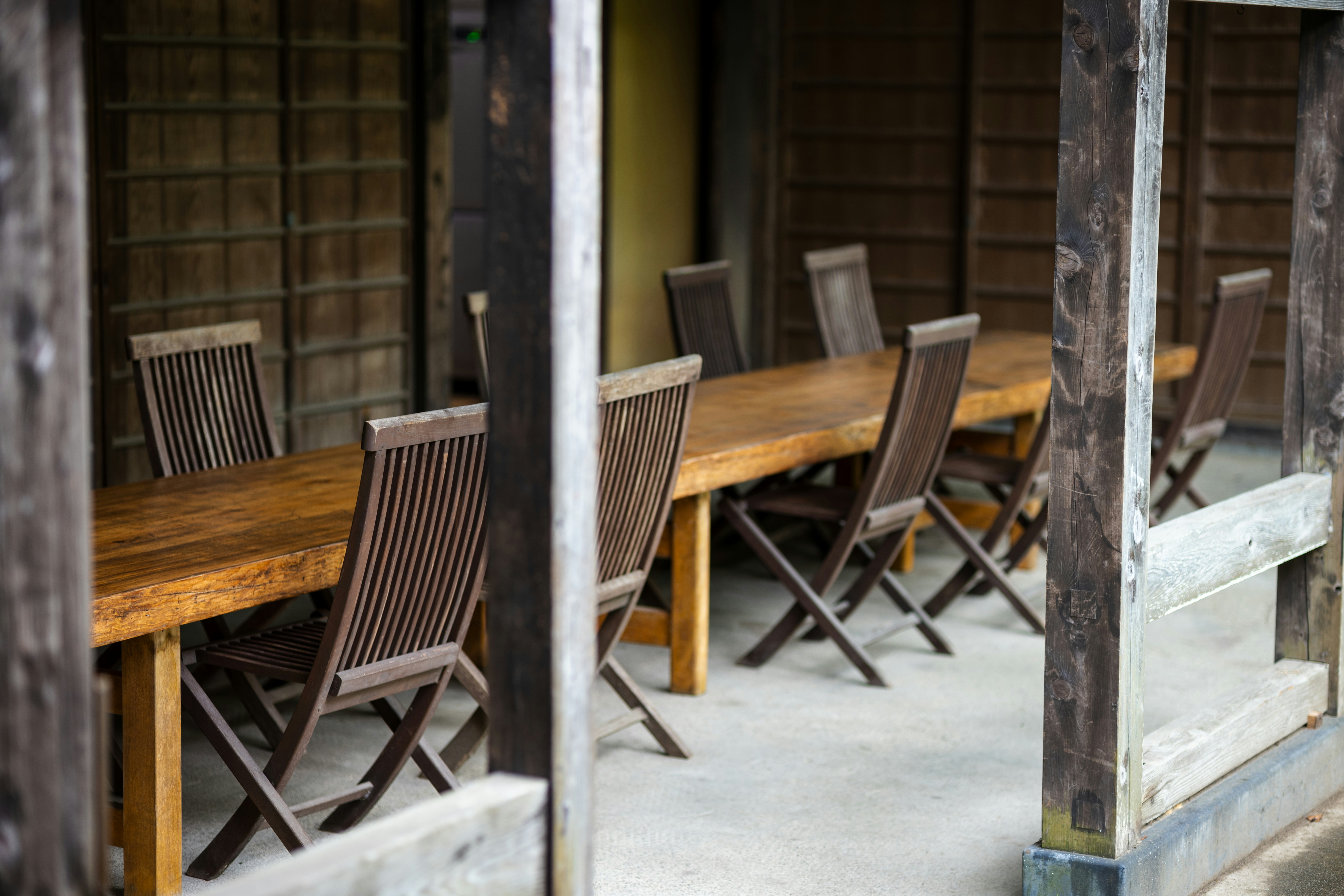 A long wooden table with chairs around it photo – Free Wood Image on ...