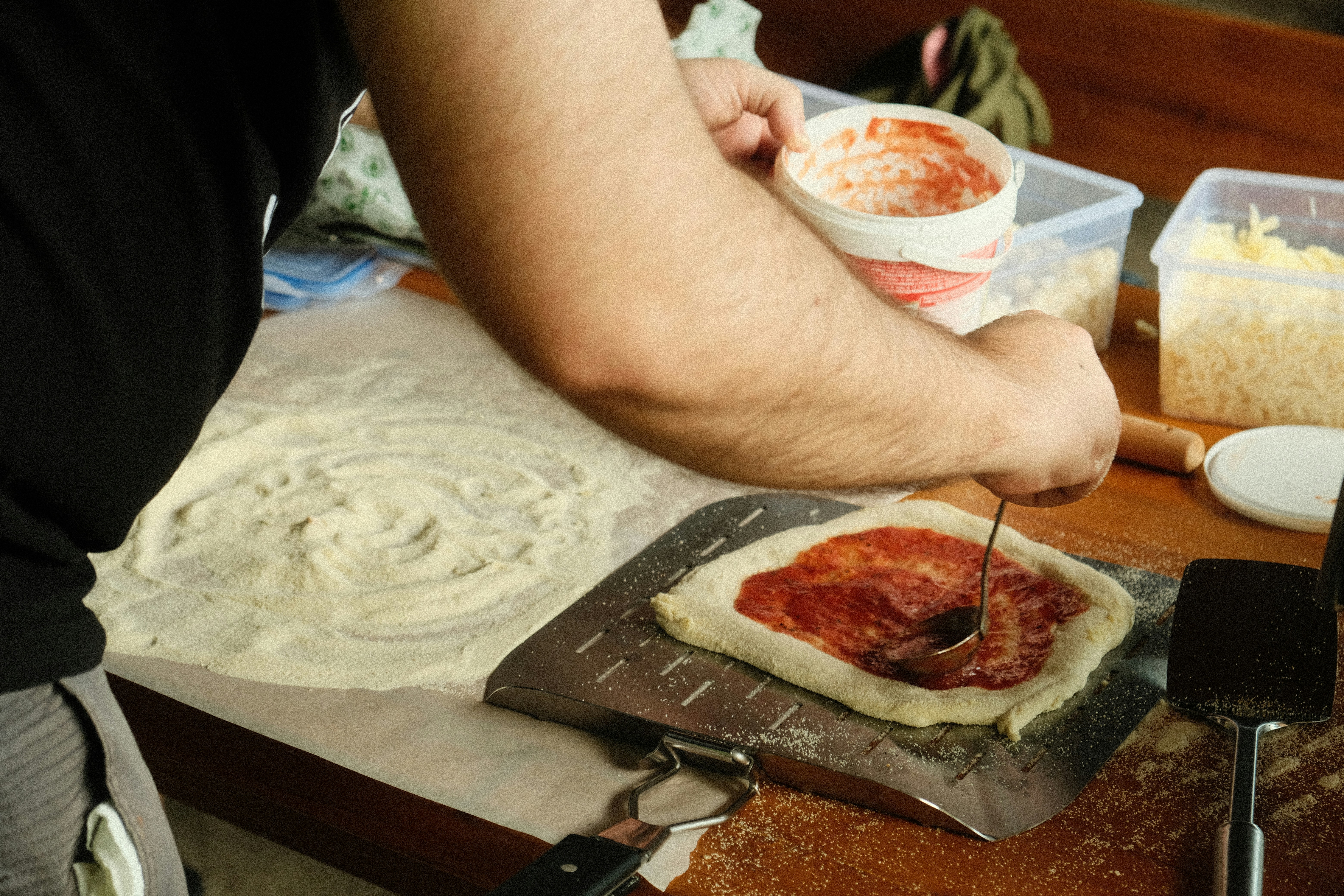 Saucy Precision: Spreading Pepperoni onto a Doughy Canvas