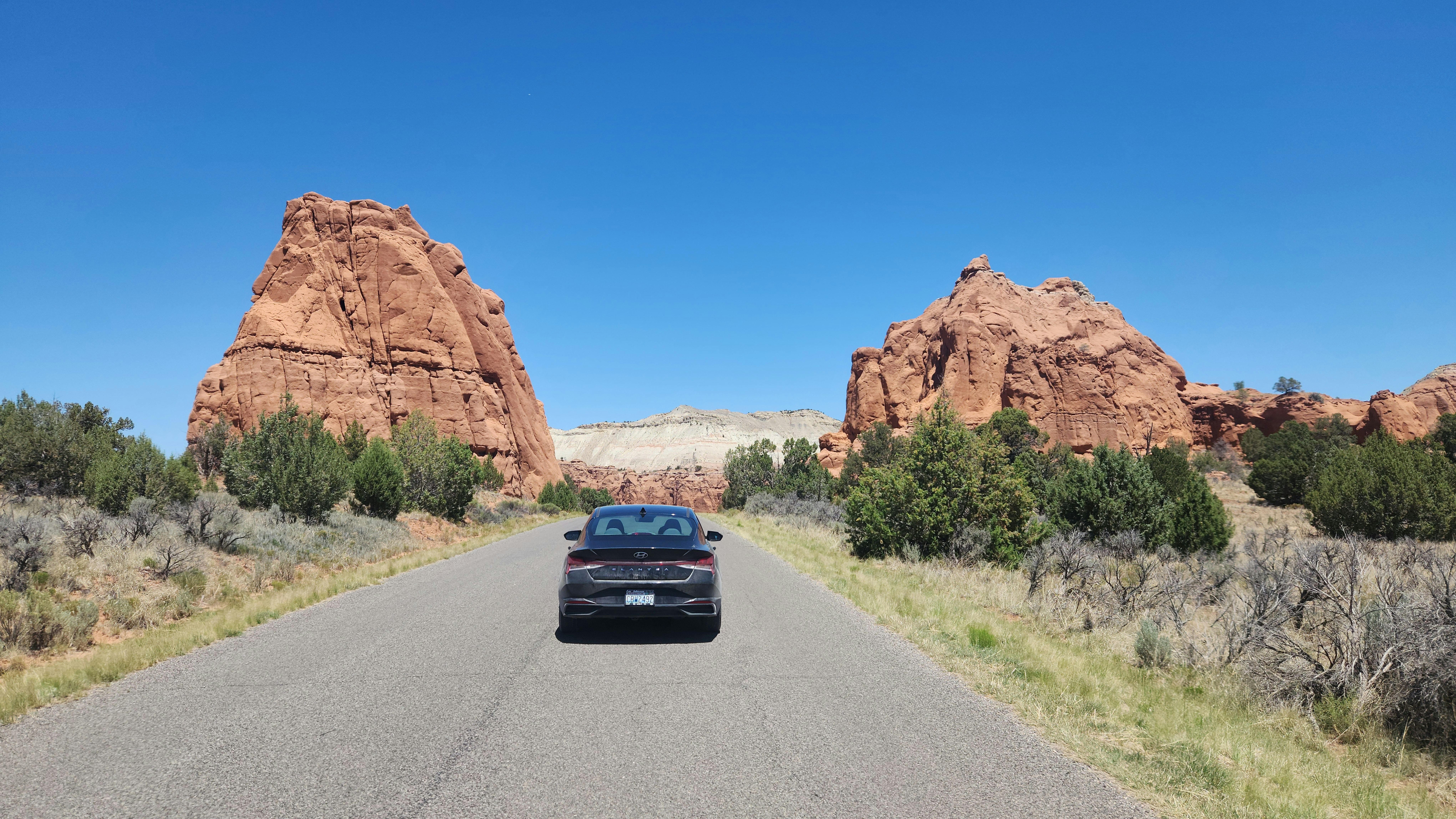 A car driving down a road in the desert photo – Free Kodachrome basin ...