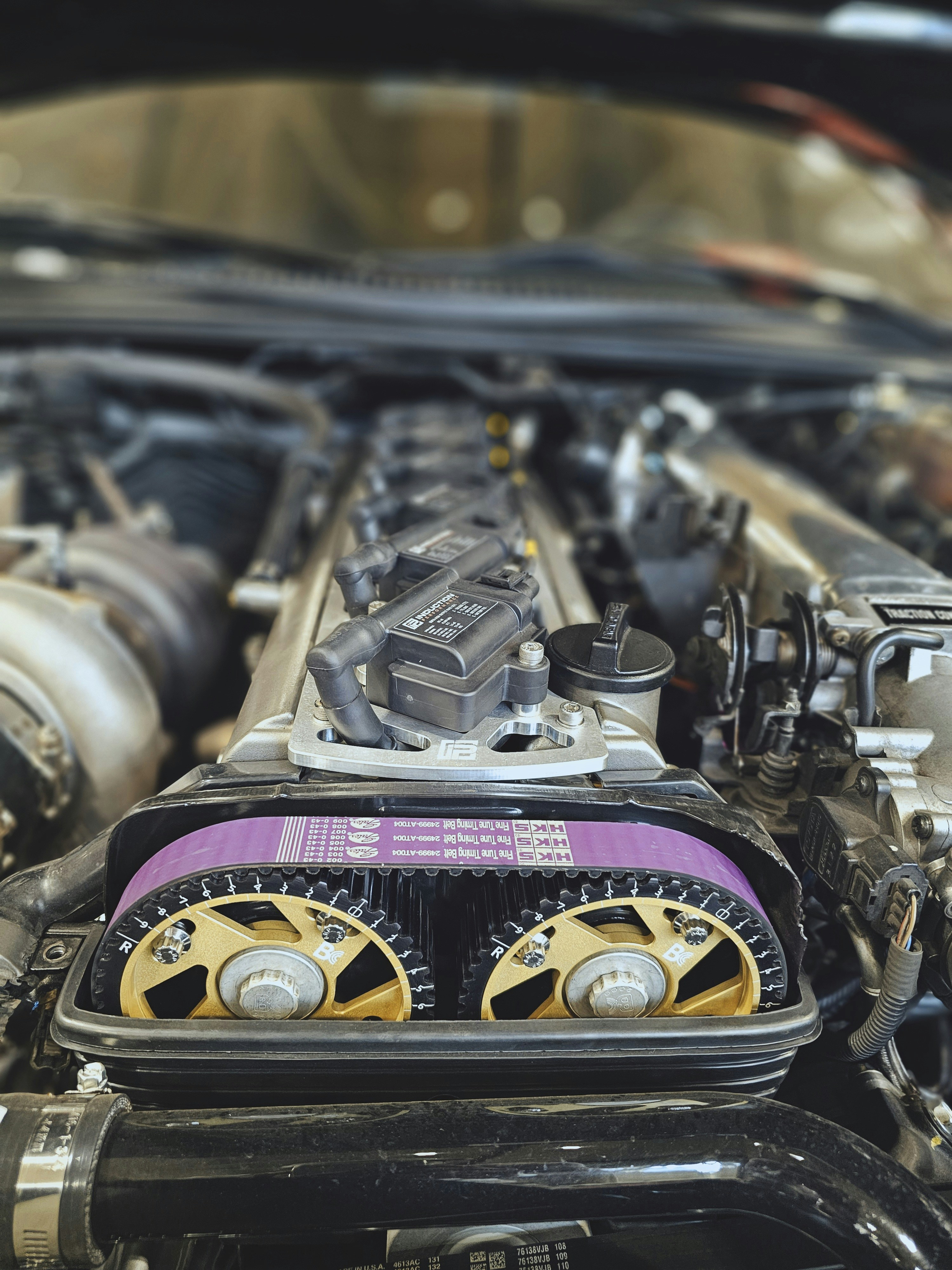 Purple Belt Heart: A Close-Up Look at the Engine's Gold Pulley Assembly