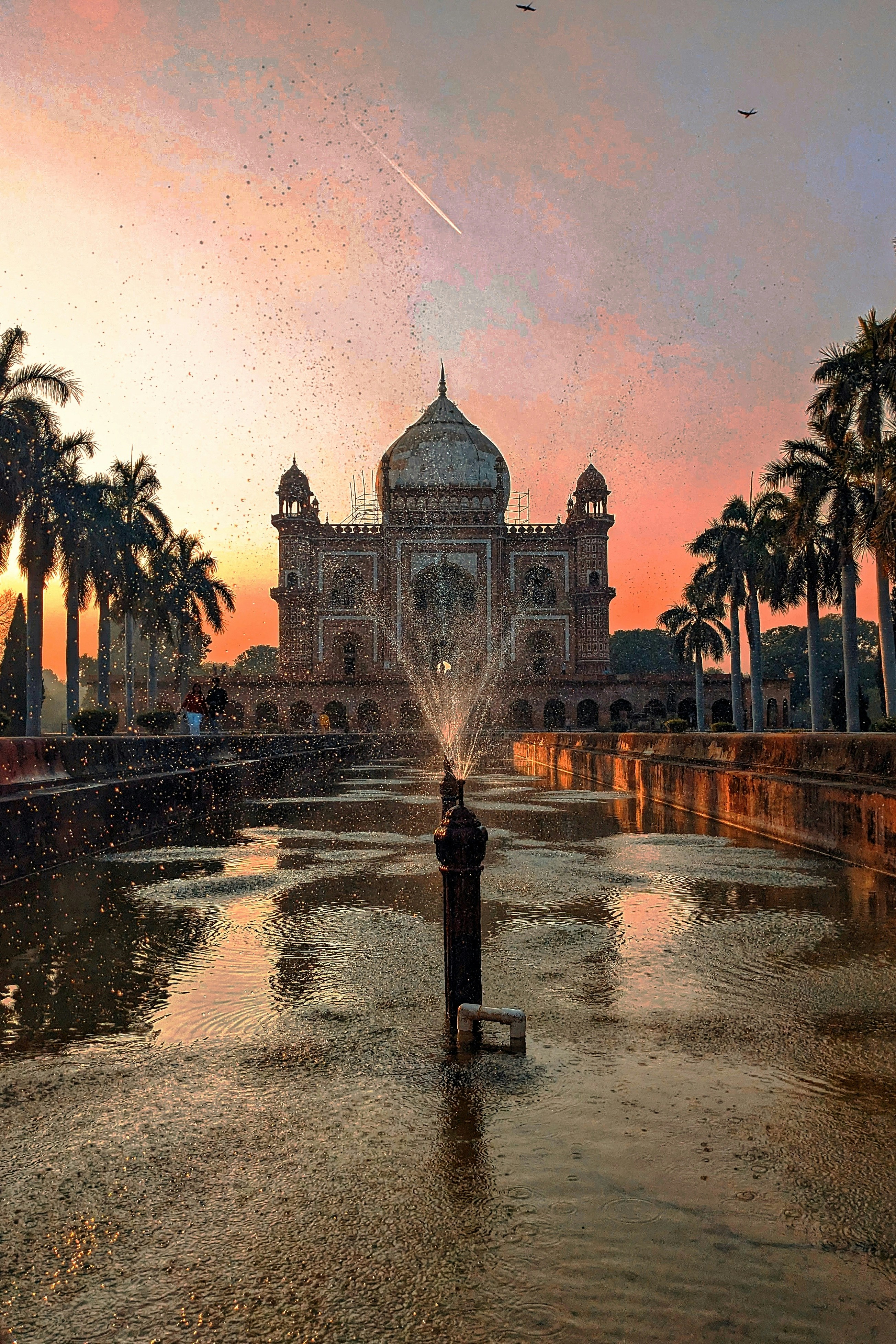 This image shows the Safdarjung's Tomb, a white marble mausoleum located in Delhi, India. The mausoleum was built in the 16th century by the Mughal emperor Shah Jahan for his wife Mumtaz Mahal. It is considered to be one of the finest examples of Mughal architecture in India.