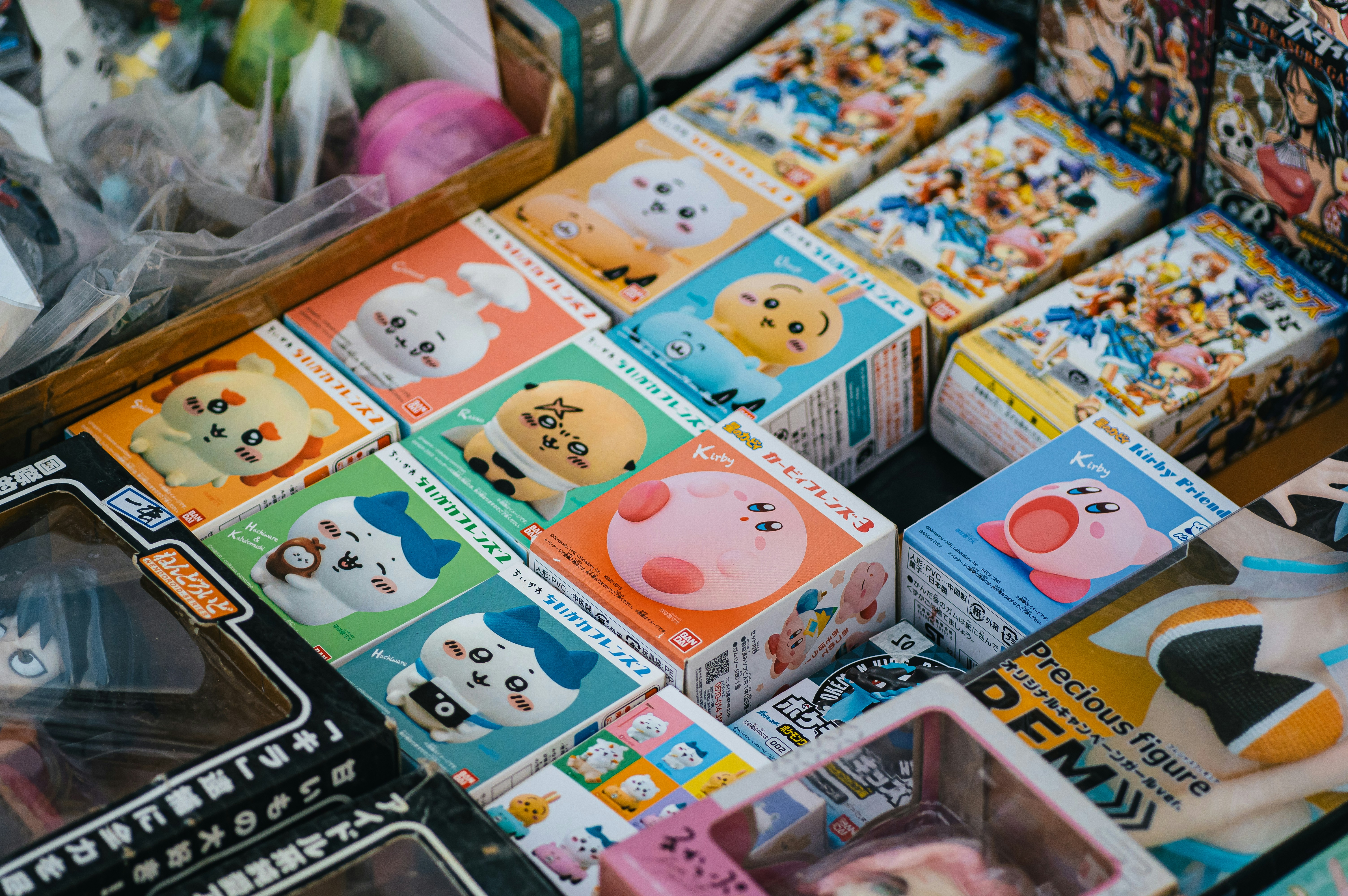 Colorful product packaging featuring cartoon animal faces arranged in a playful retail display.