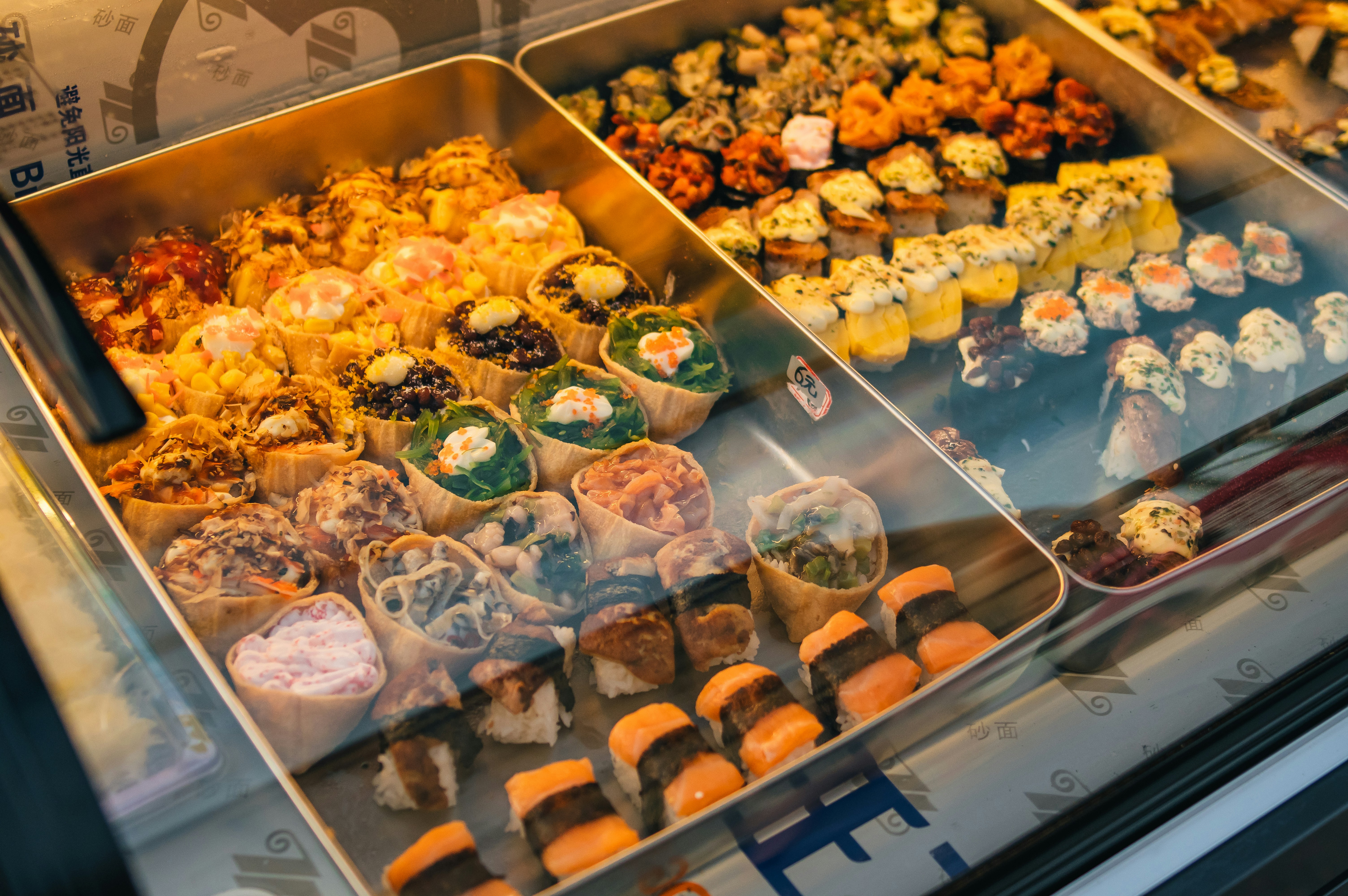 A display case filled with lots of different types of food photo – Free ...