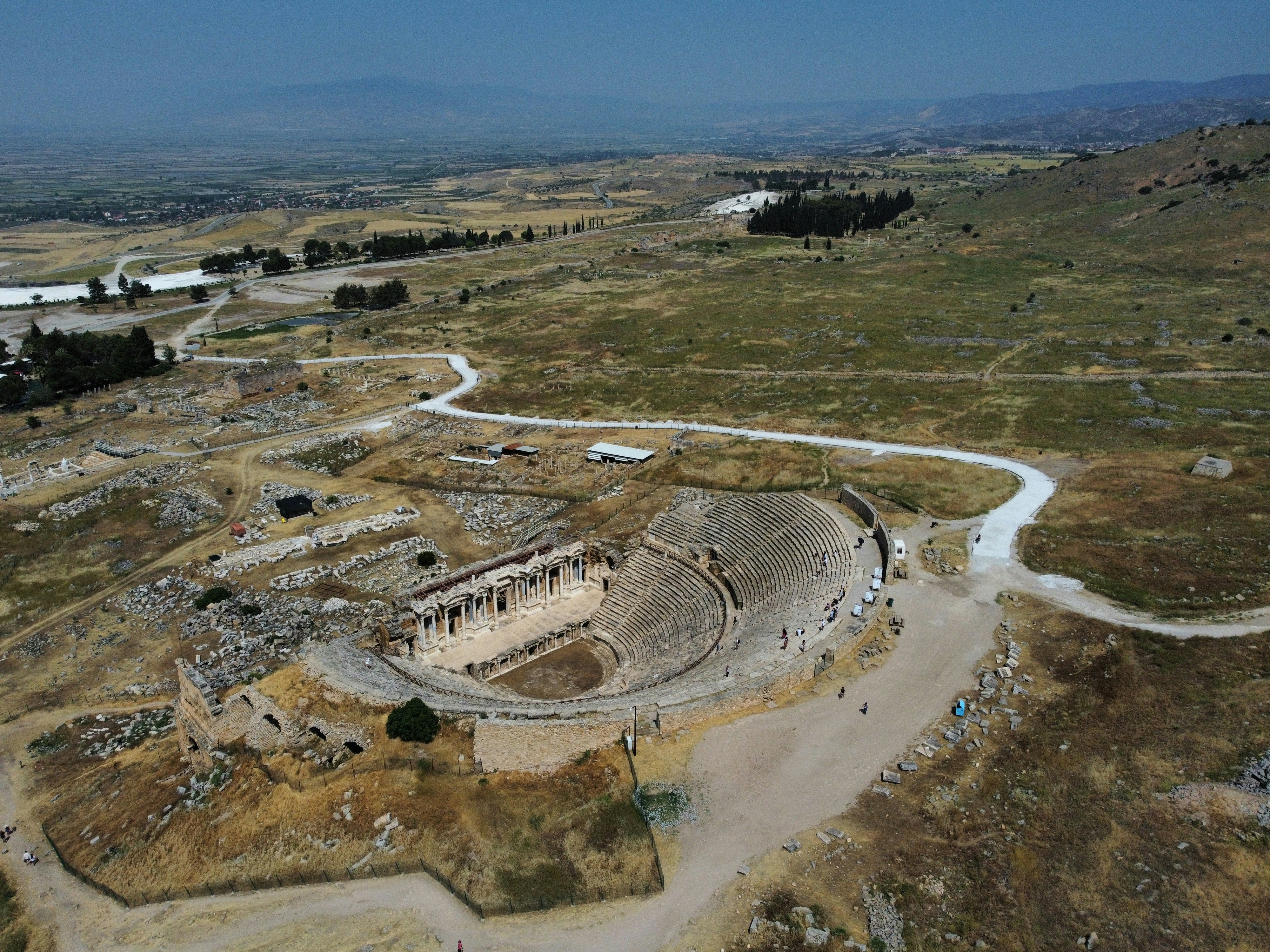 An aerial view of a large building in the middle of a field photo ...