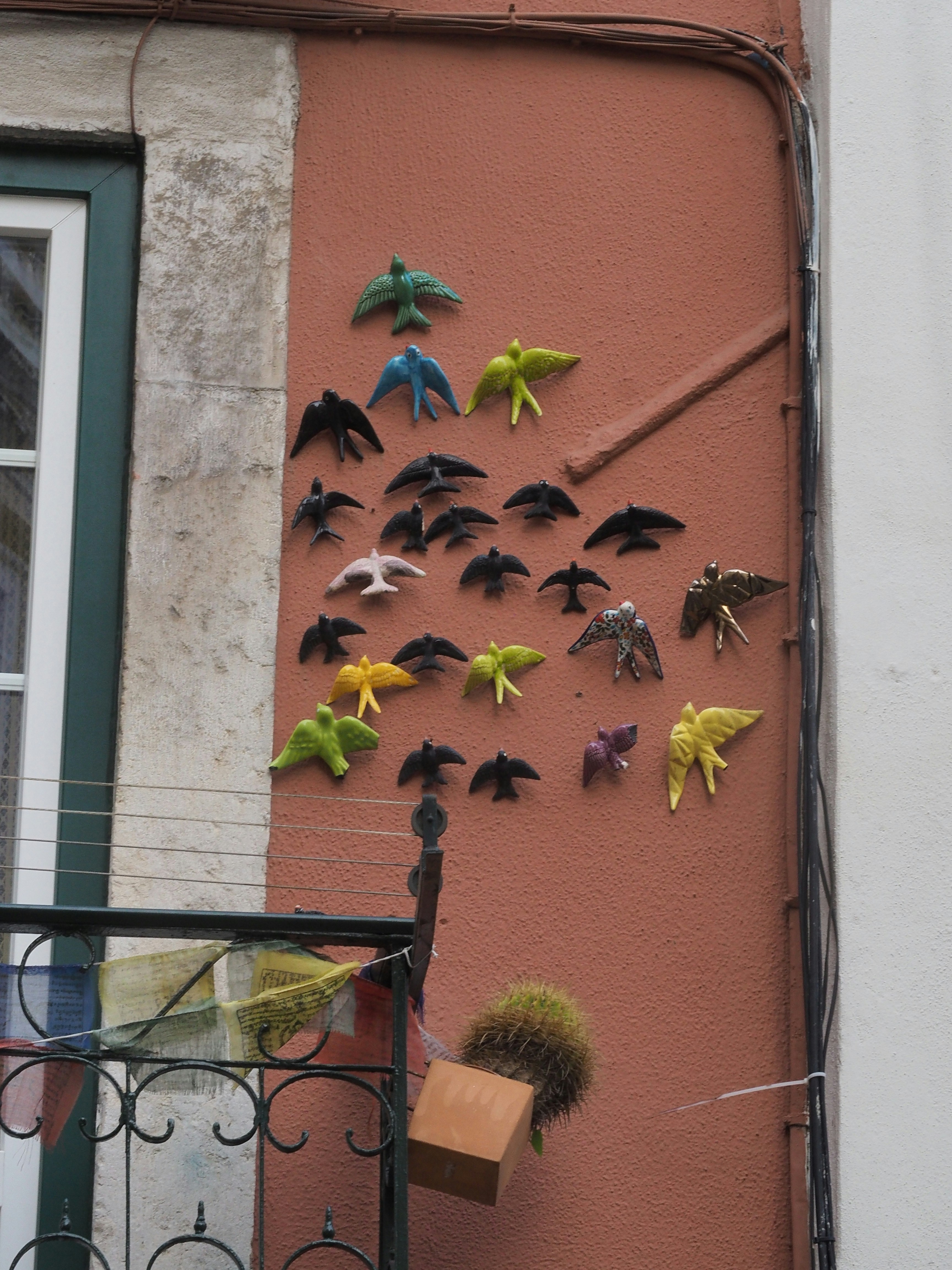 Terracotta Flock: a Burst of Color from Street Bird Sculptures