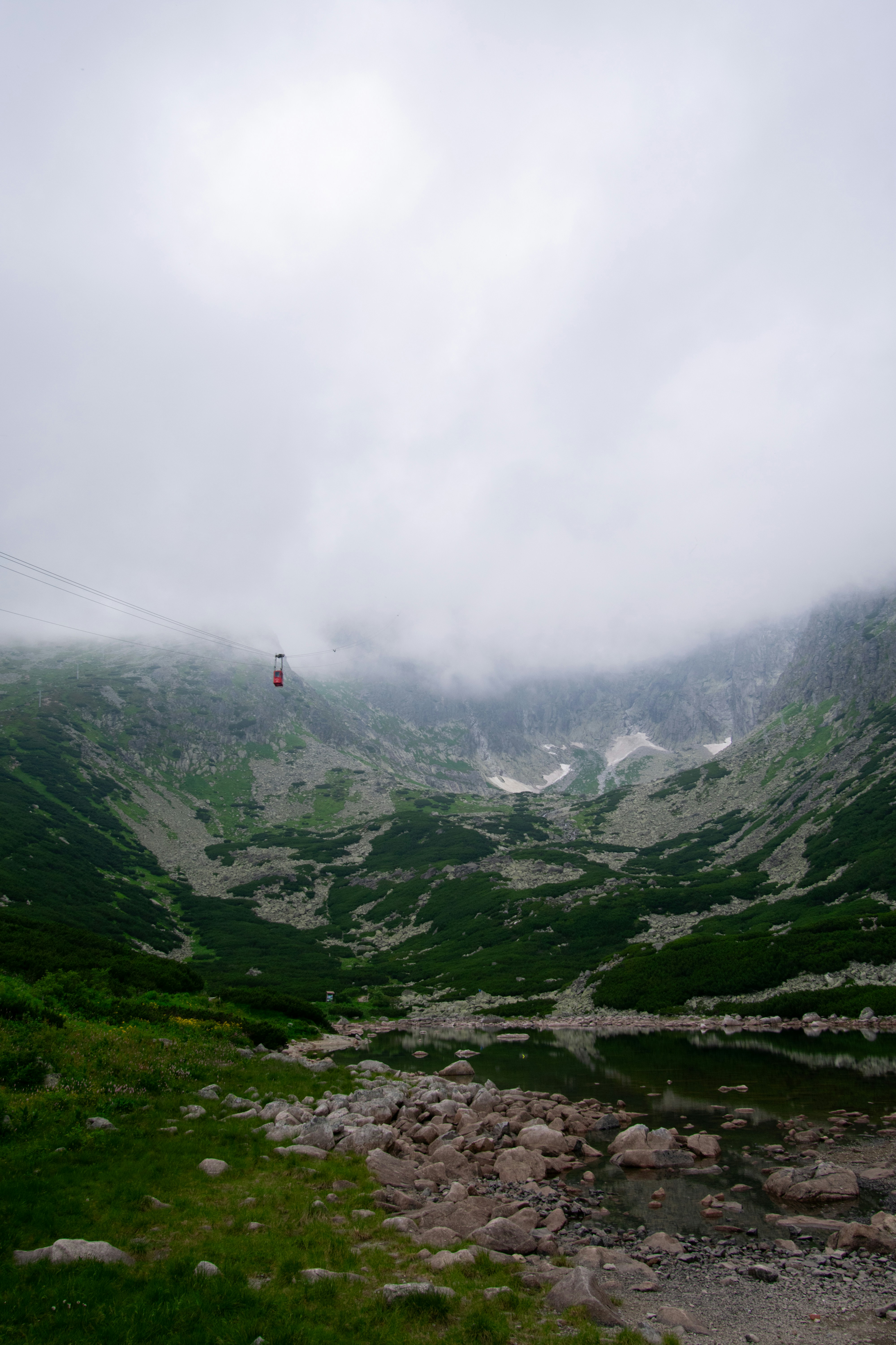 Cable Car Whisper over a Misty Alpine Basin