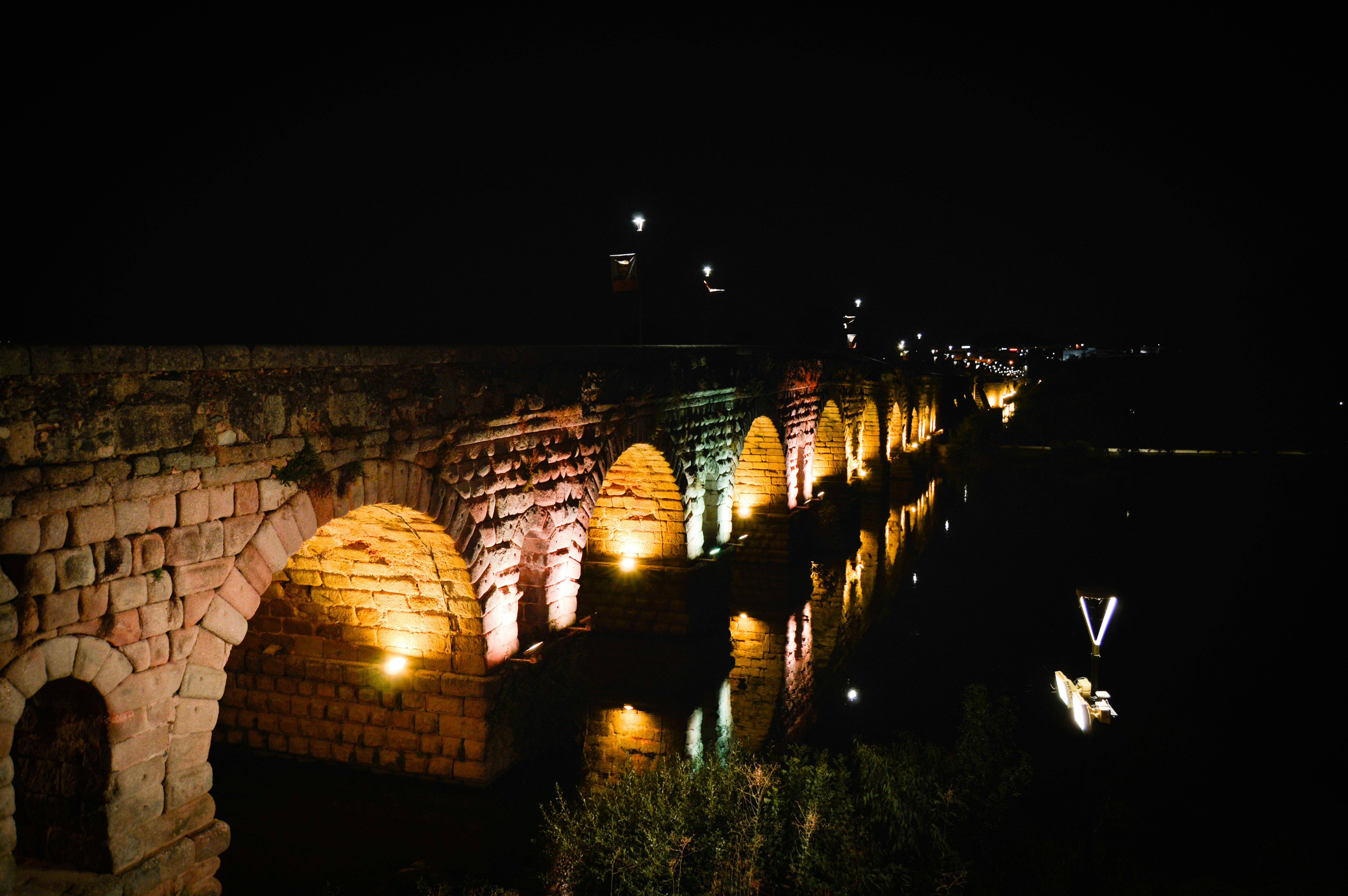 Glowing Arches: Night Fortress Along the River