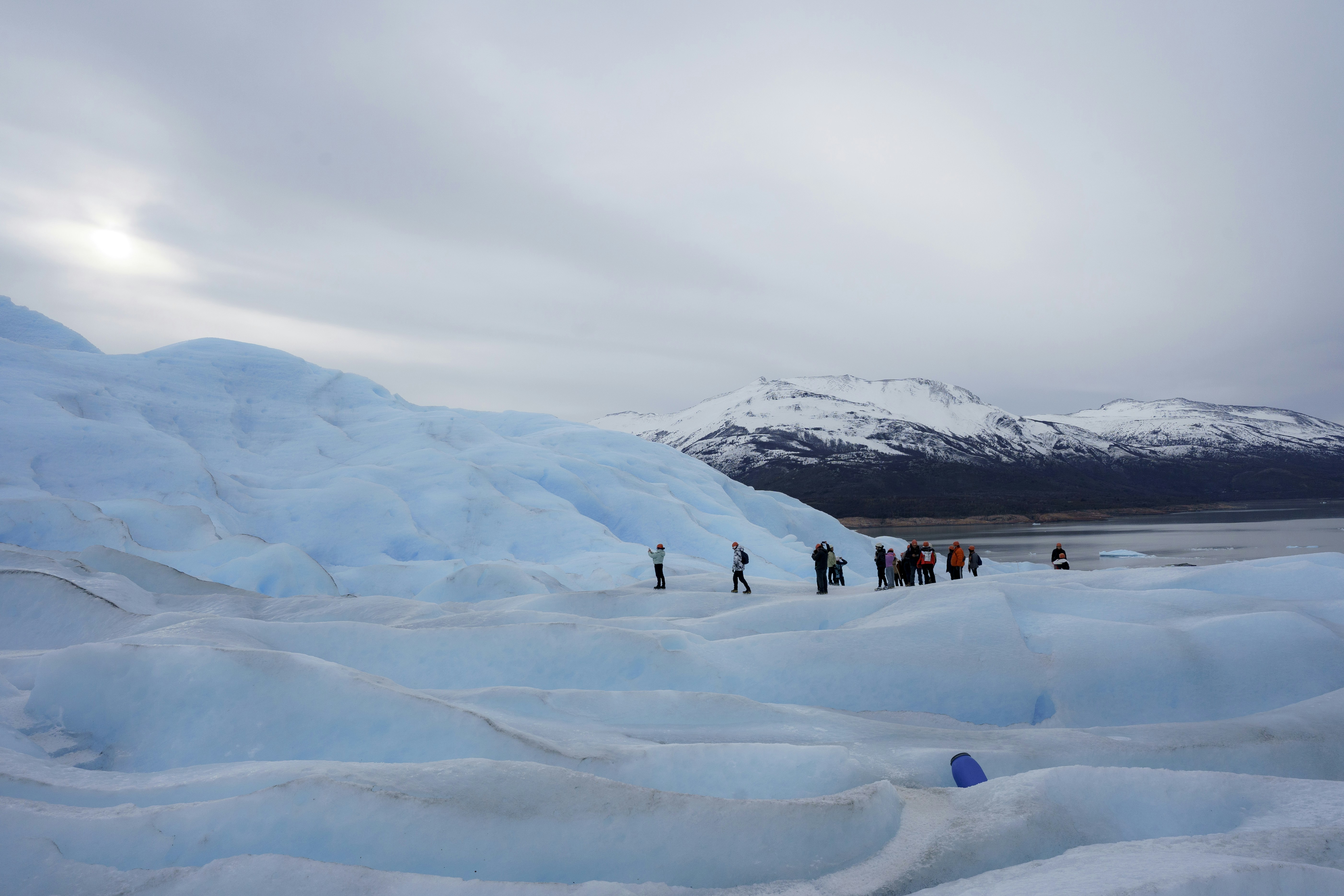 Glacial Trek: A Narrow Line of Explorers Across Icefields
