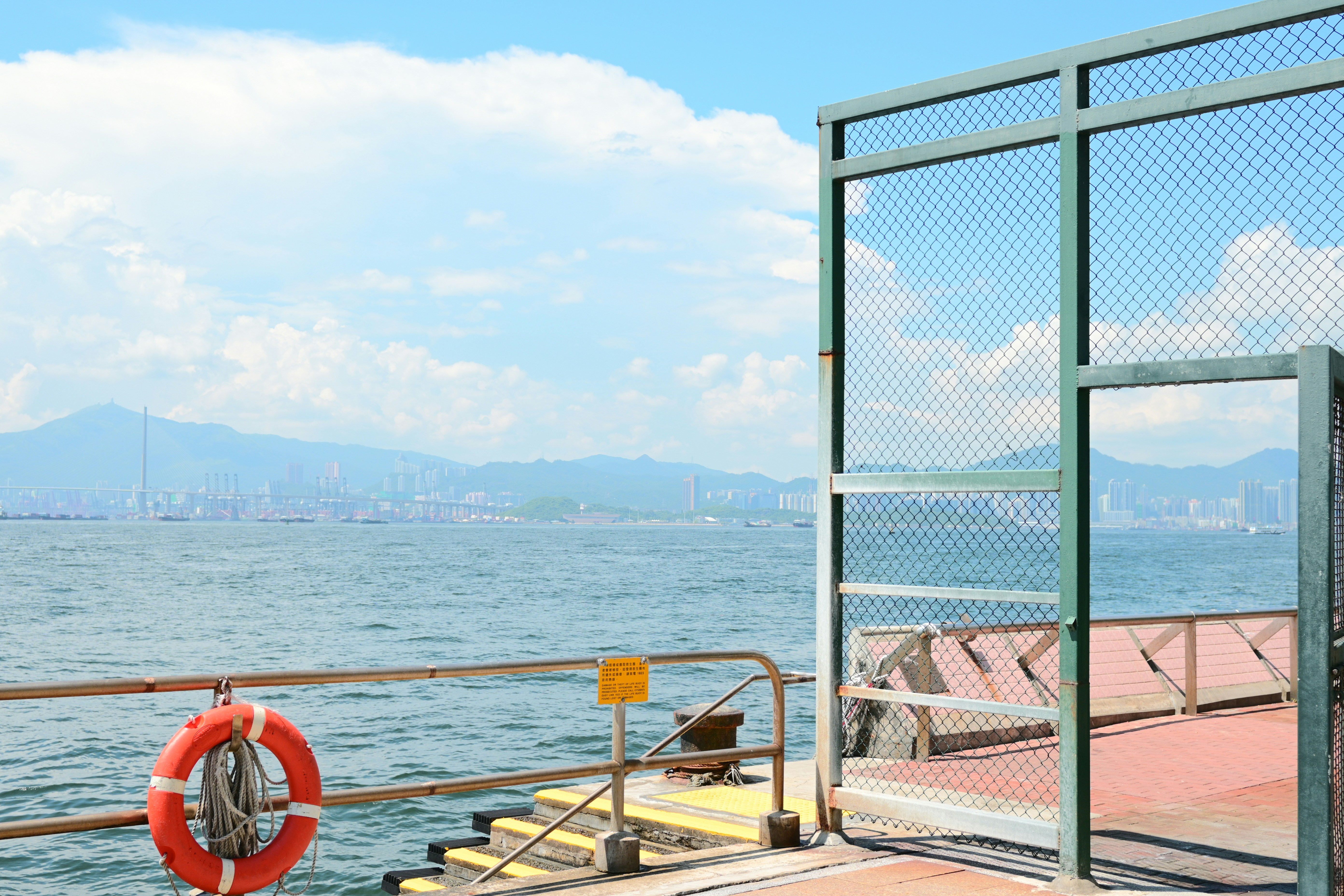 A boat dock with a life preserver and a life preserver photo – Free ...