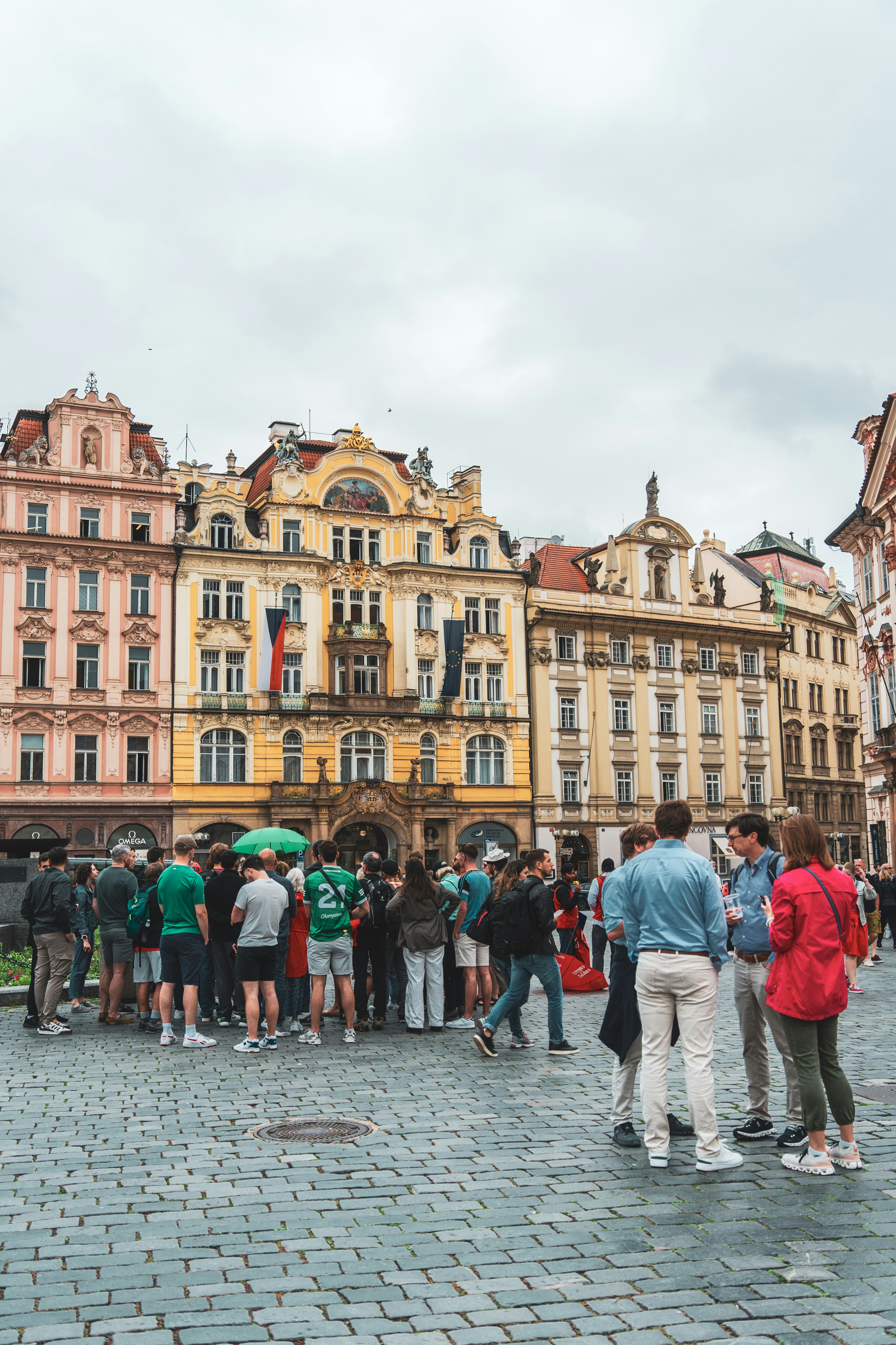 Pastel Baroque Facades Framing a Bustling Cobblestone Square