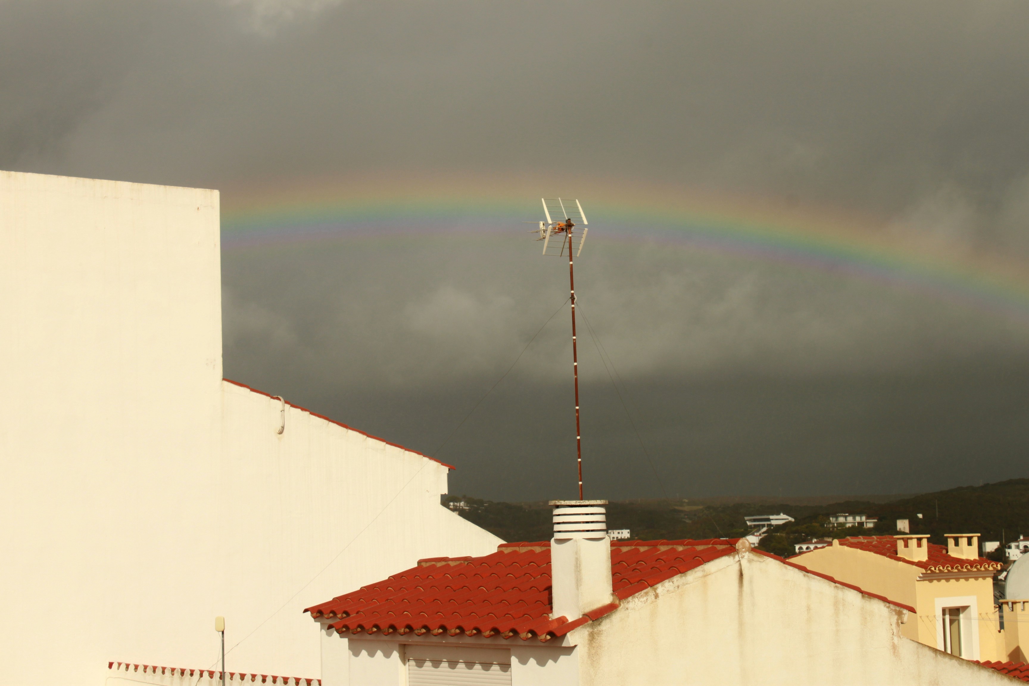 Rainbow Crossing the Rooftop Canvas