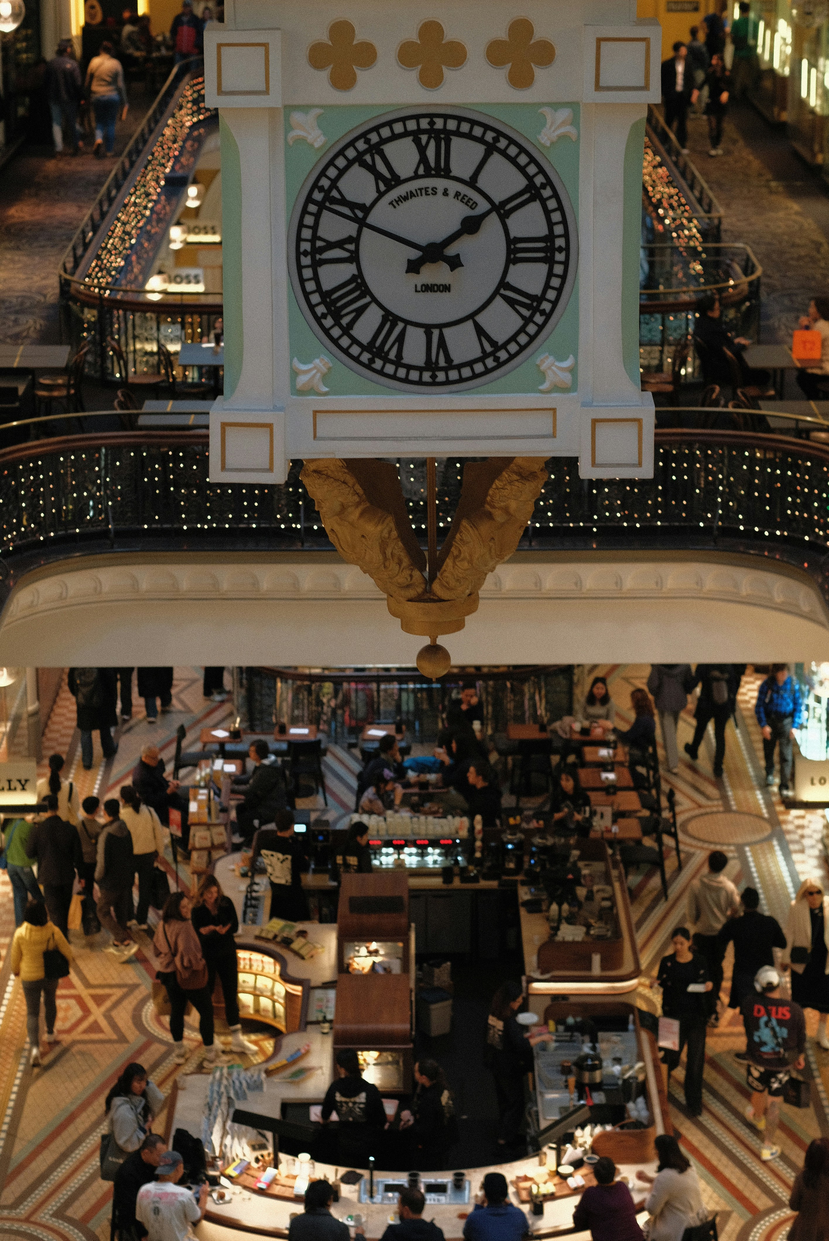 Timekeeper Over the Atrium: A London Clock Tower in a Bustling Mall