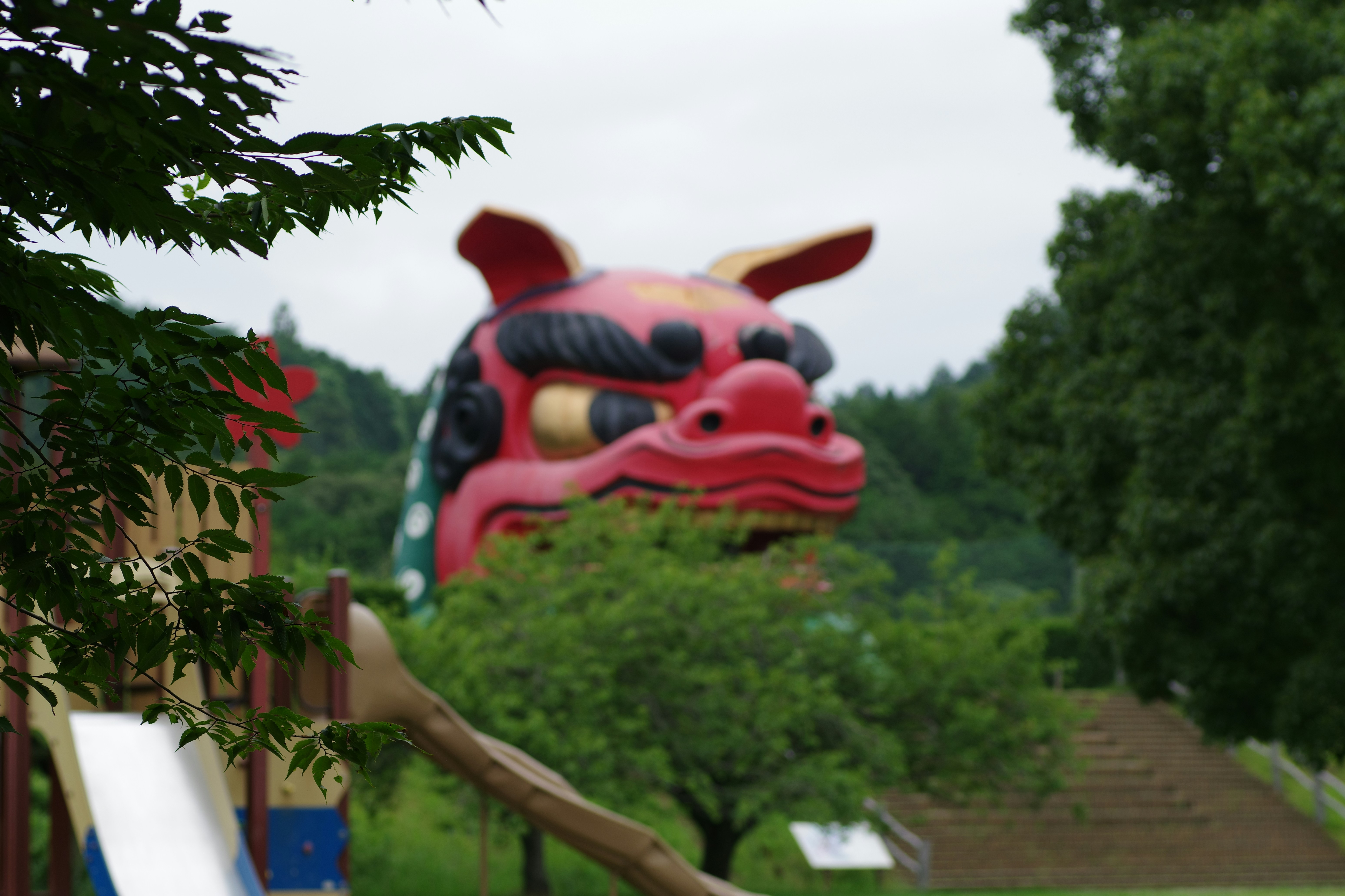 Soft-Focus Dragon Guardian Over a Quiet Park