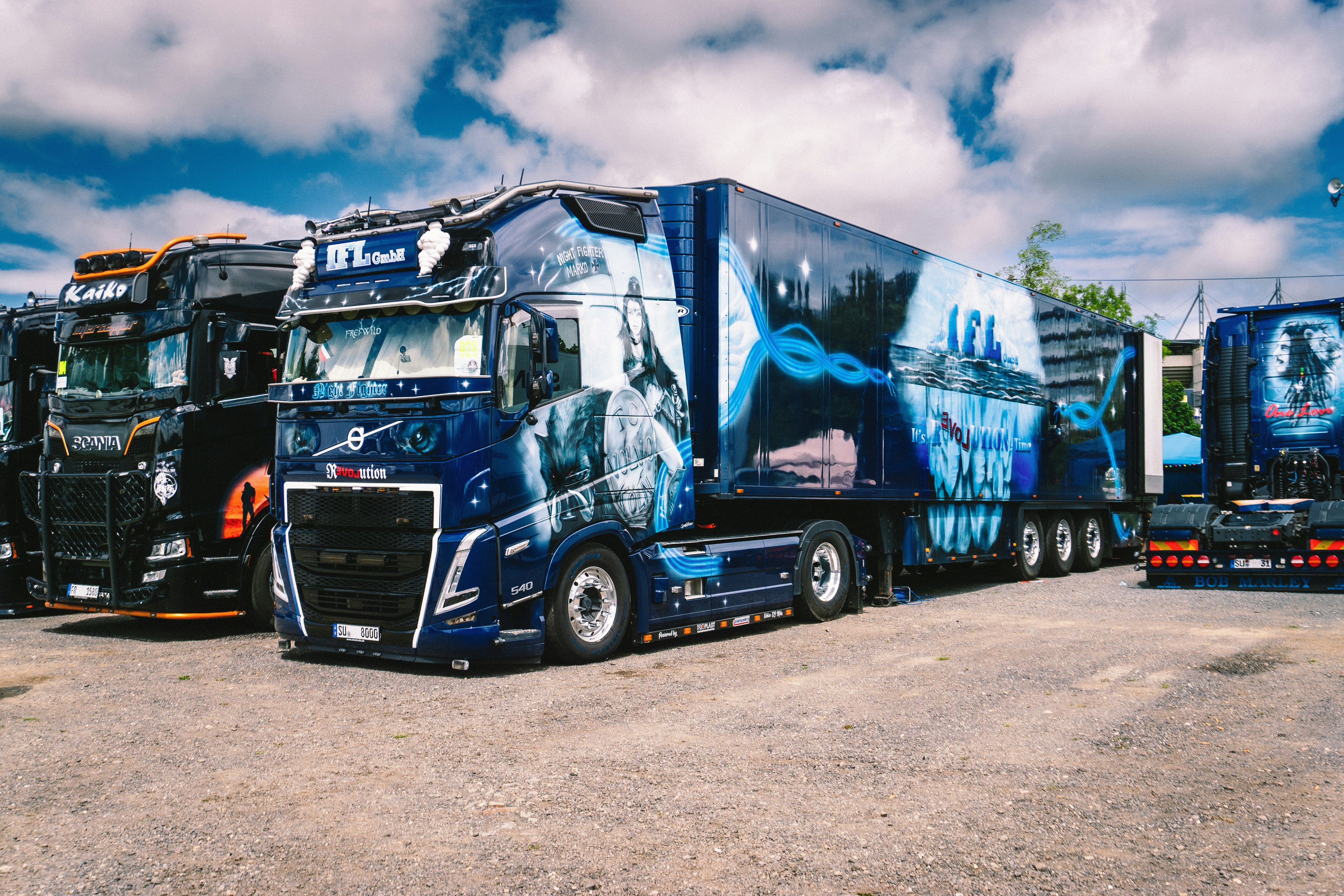 A group of semi trucks parked next to each other photo – Free Germany ...