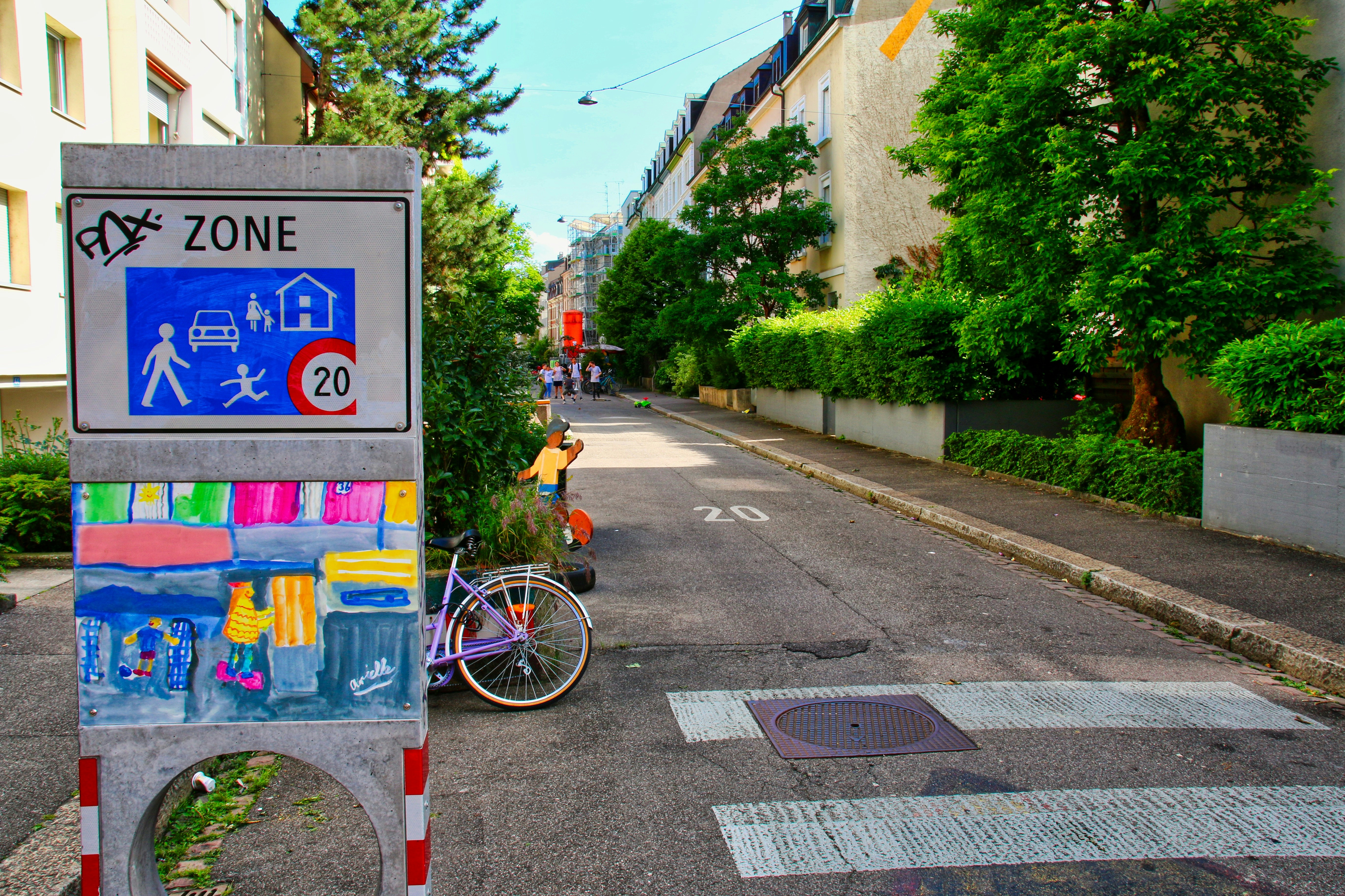 There is a sign on the side of the road photo – Free Children playing ...