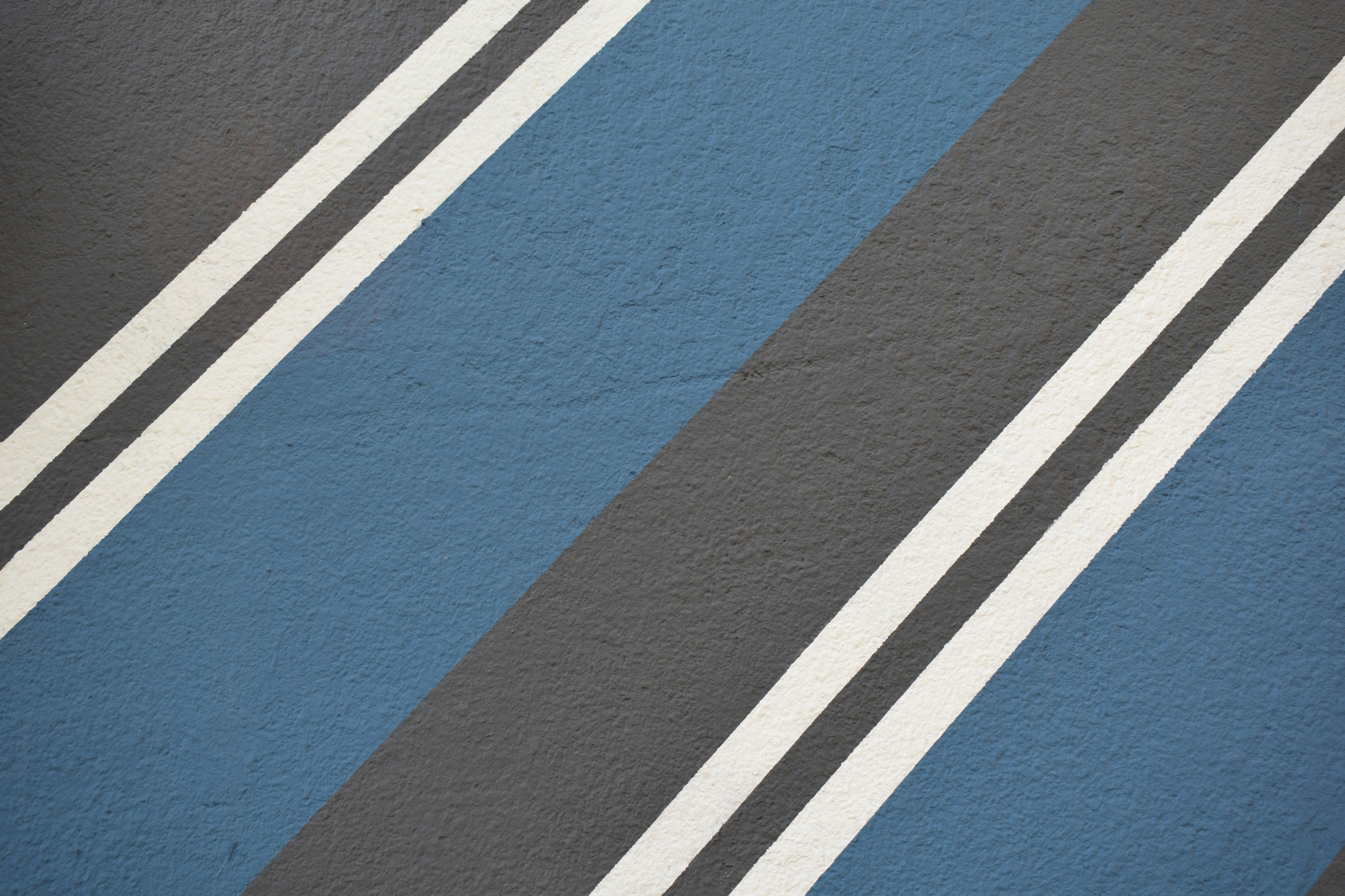 A close up of a blue and black striped wall photo – Free Texture Image ...