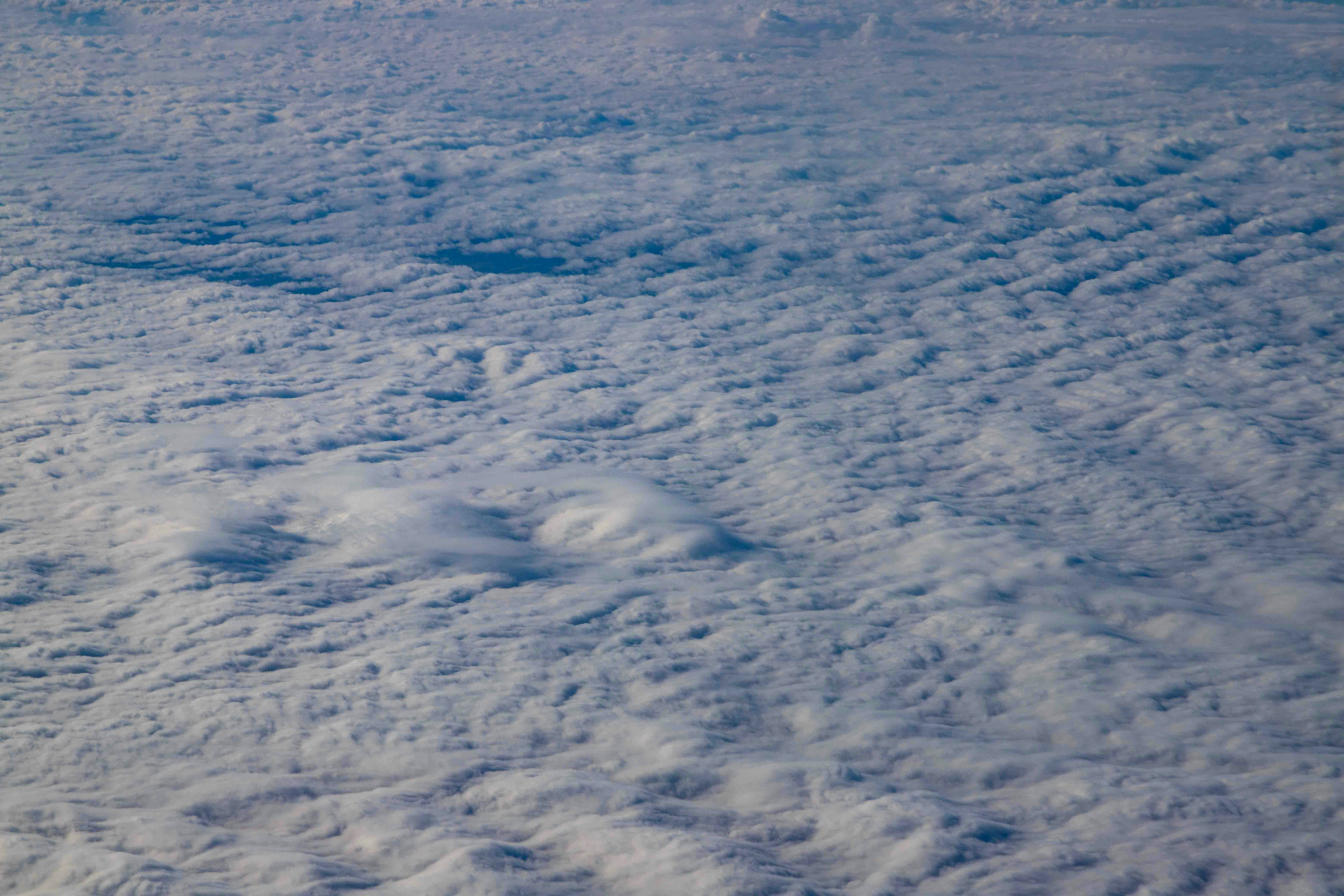 Above the Layered Seas: A Quiet Flight Through Cloud Terrain