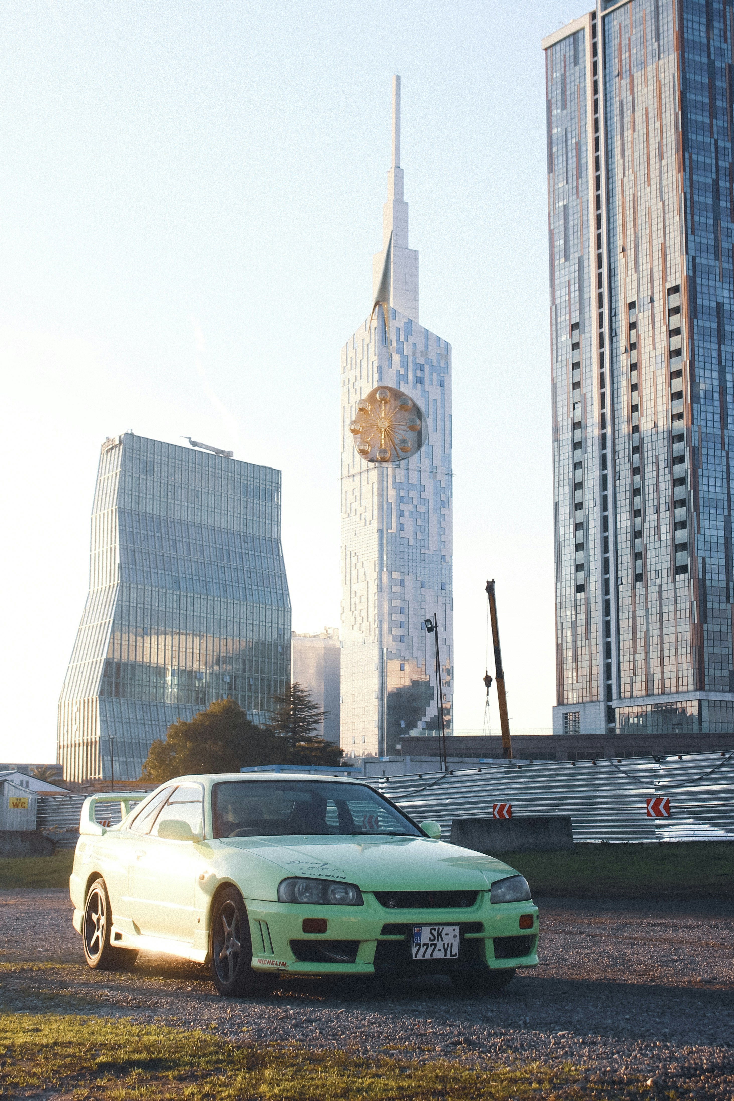 Neon Green Skyline Racer Under a Clocked Tower