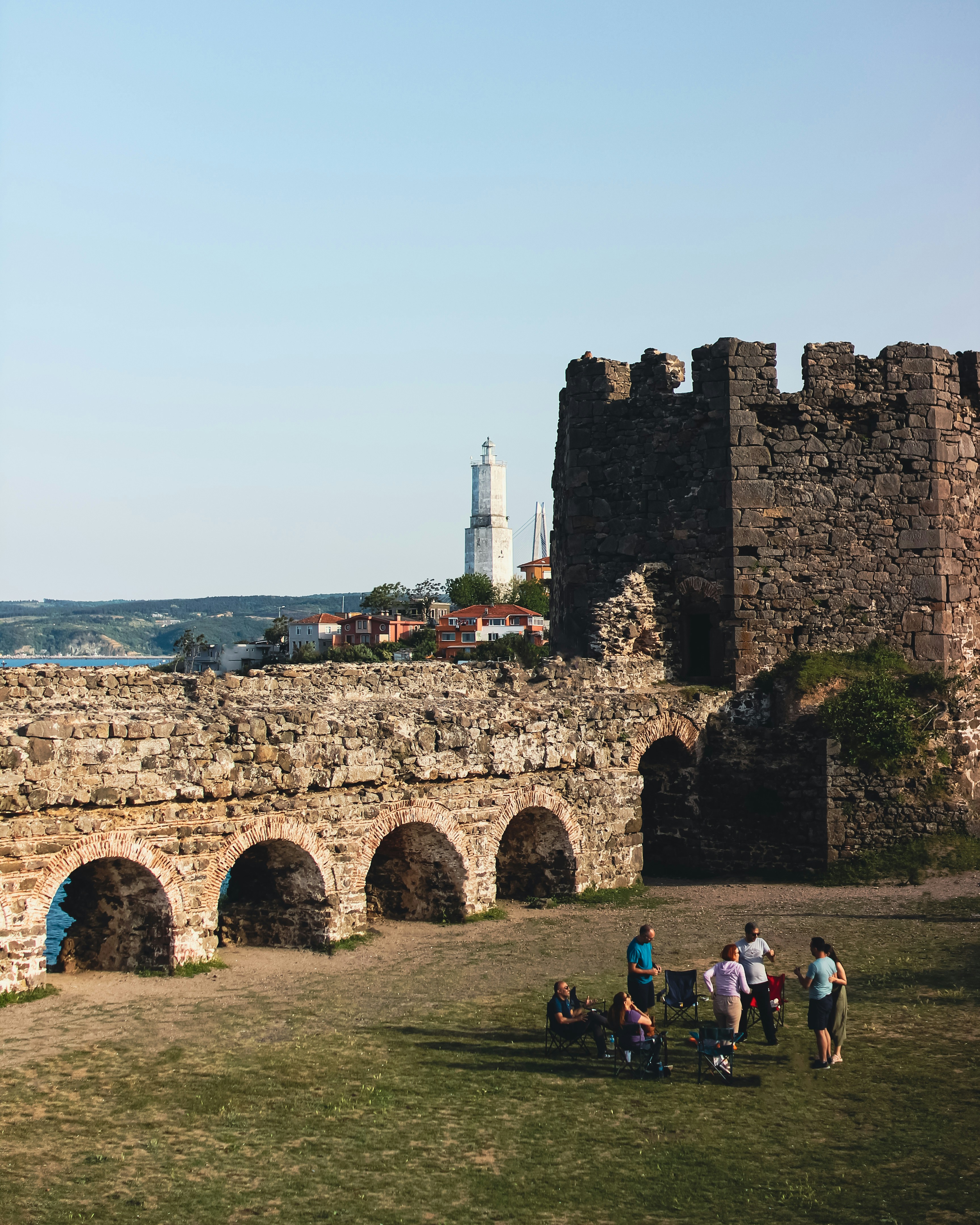 Sunlit Arches and a Seaside Fortress: A Quiet Coastal Gathering