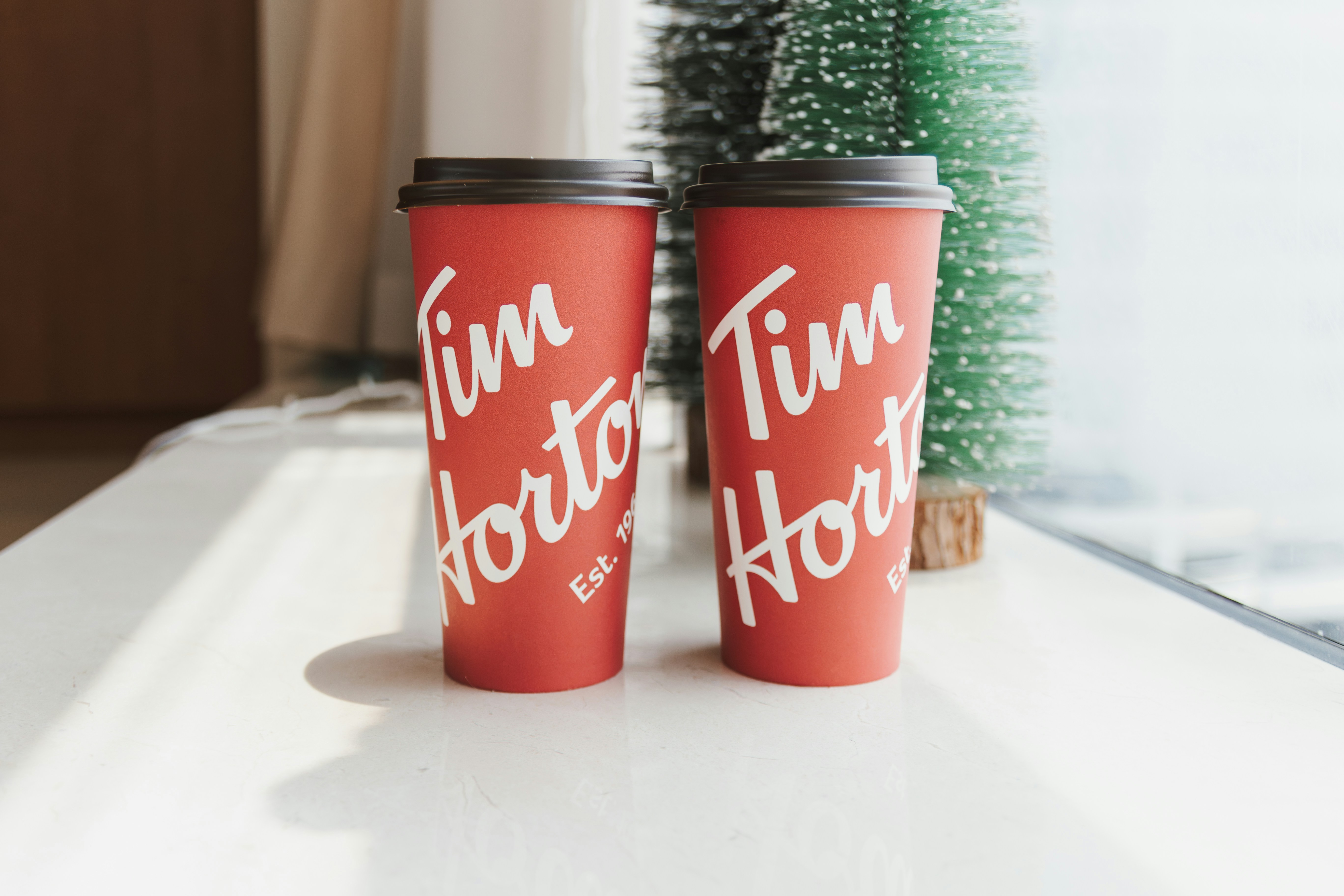 Twin Tim Hortons Cups Refracted by Winter Window Light