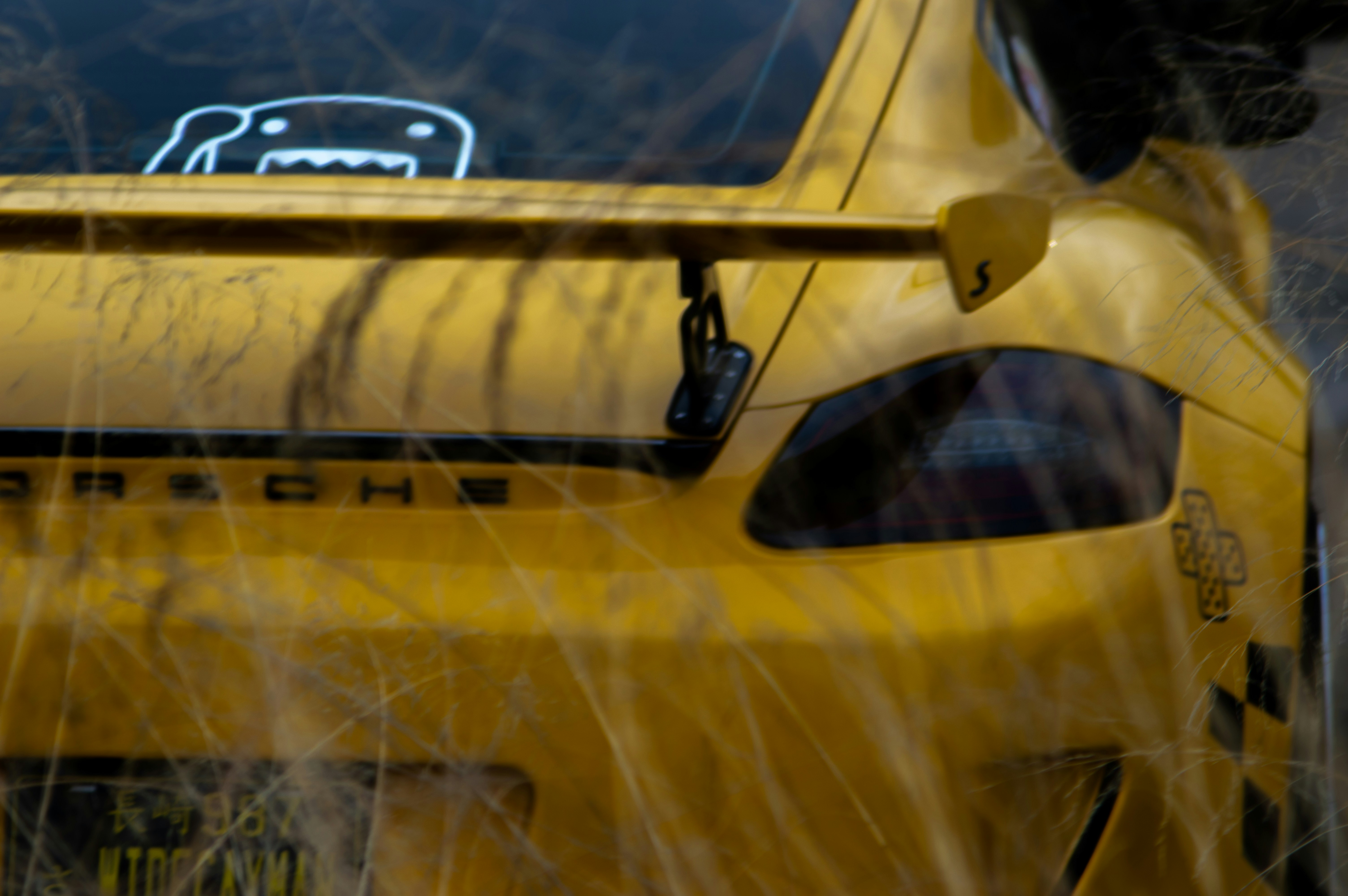 A close up of a yellow car with a sticker on it photo – Free Wallpaper ...