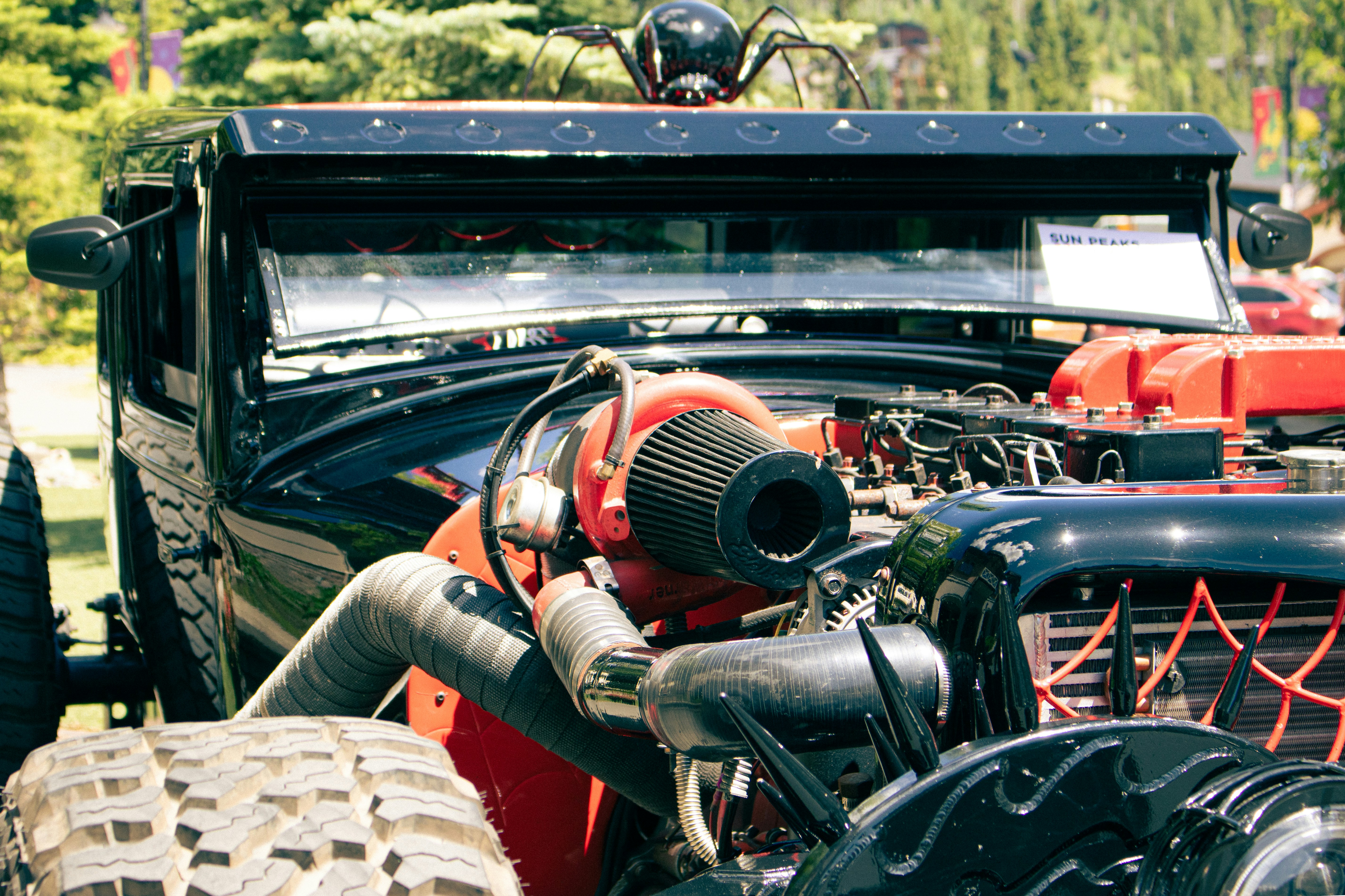 Exposed Vee of Power: Classic Car Engine in a Deserted Showroom