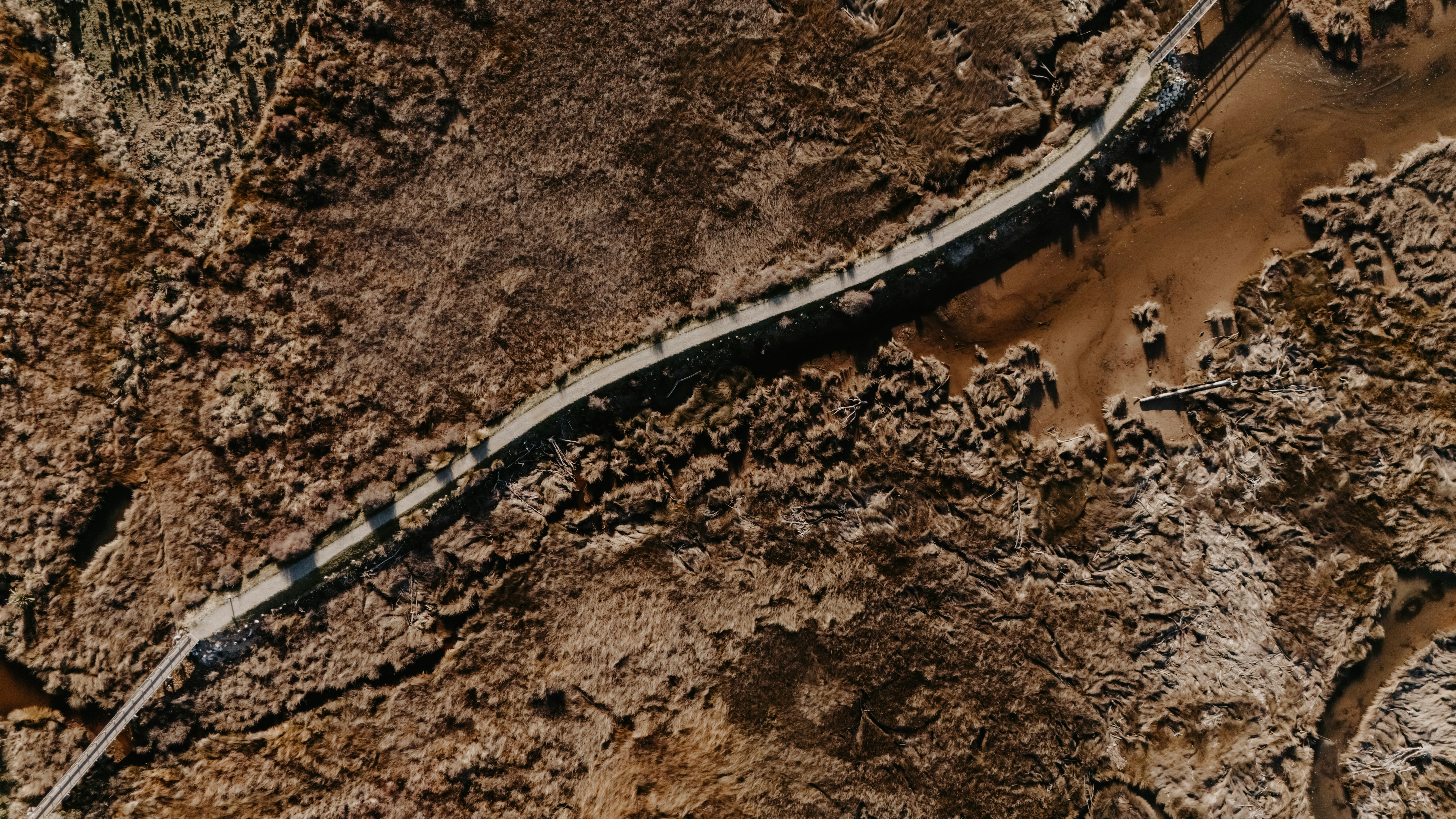 An aerial view of a river running through a rocky areamae black