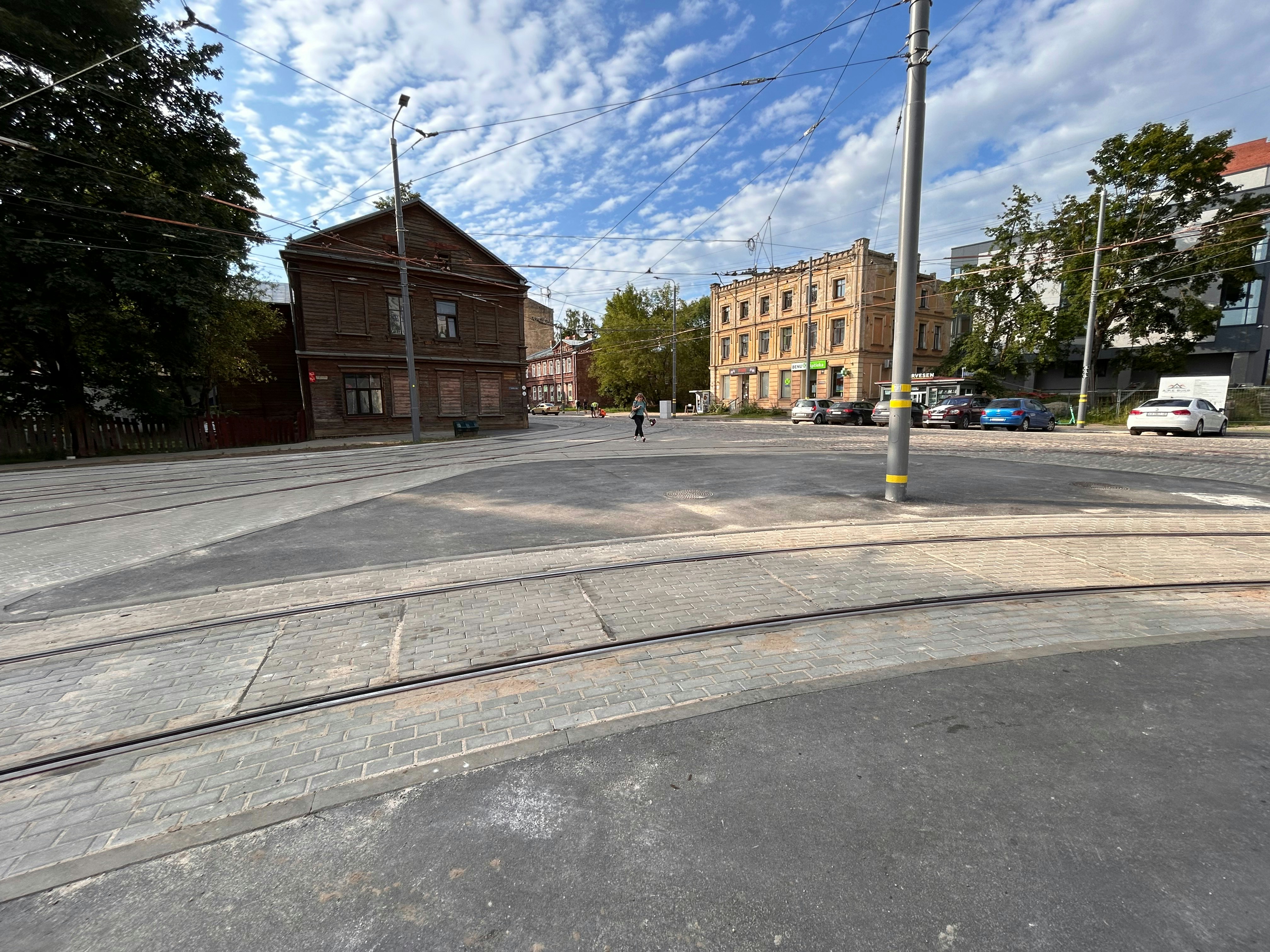 Timeworn Facades and Rails: A Quiet City Crossing