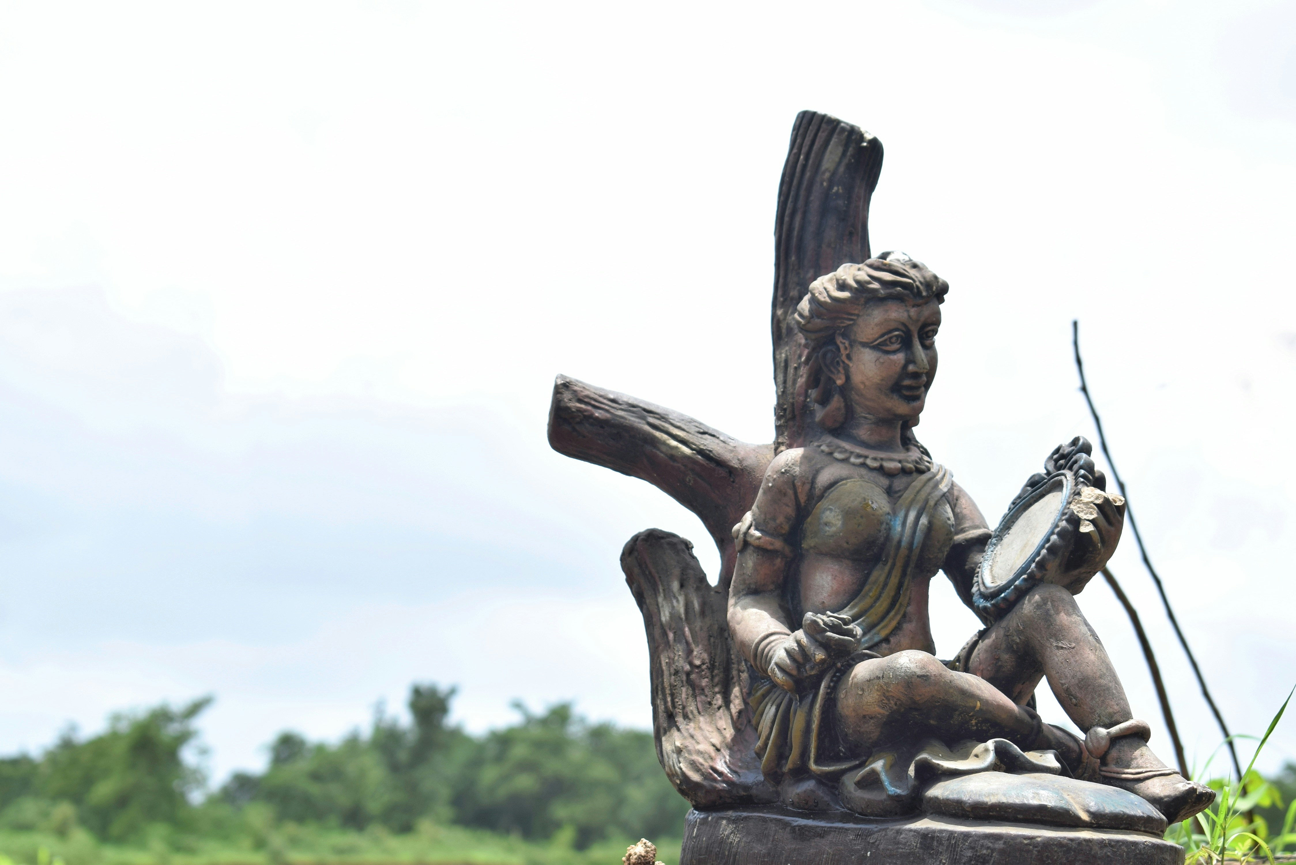 Serenity in Stone: A Seated Sculpture