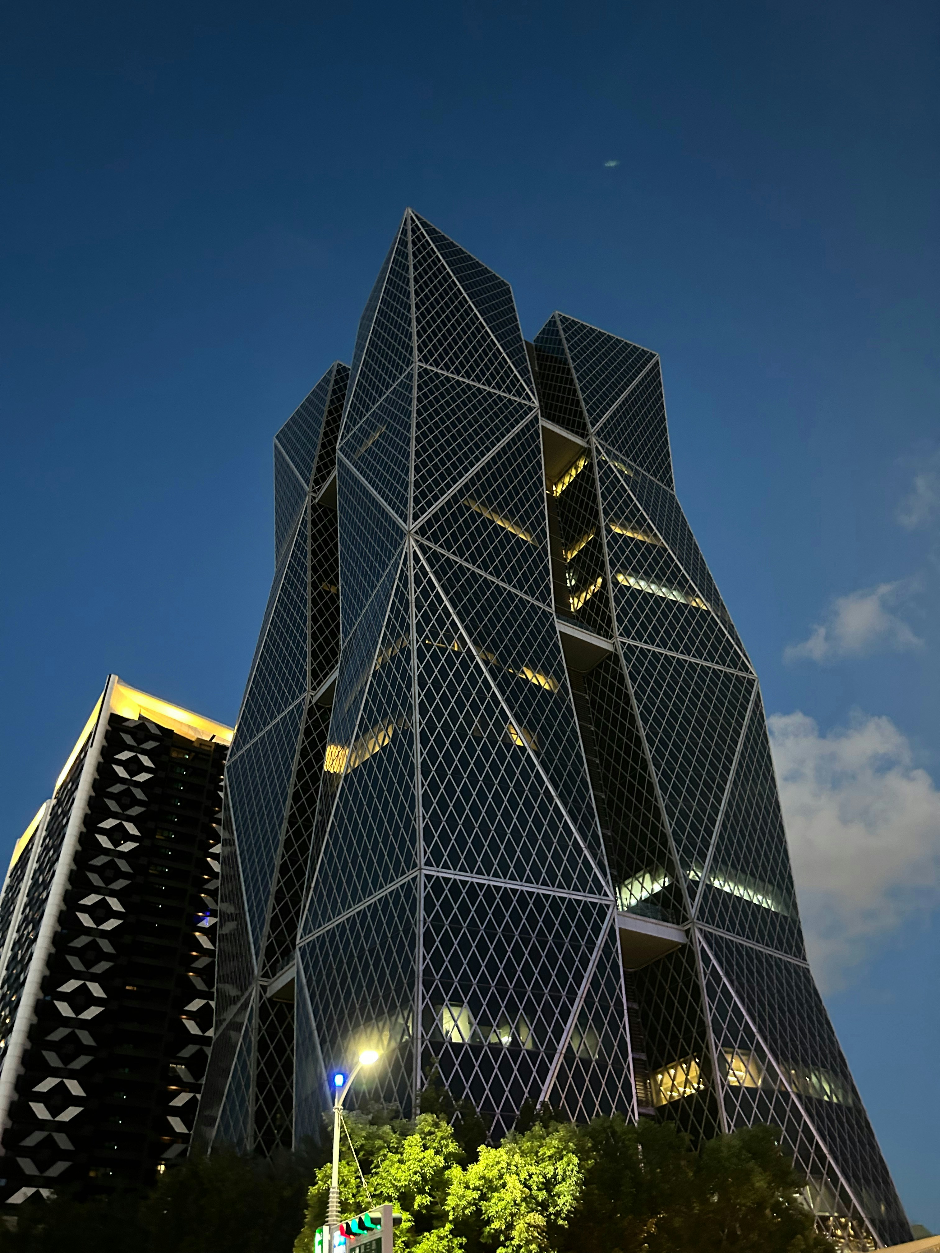 Diamond Lattice Skyscraper Reaches Toward a Velvet Evening Sky