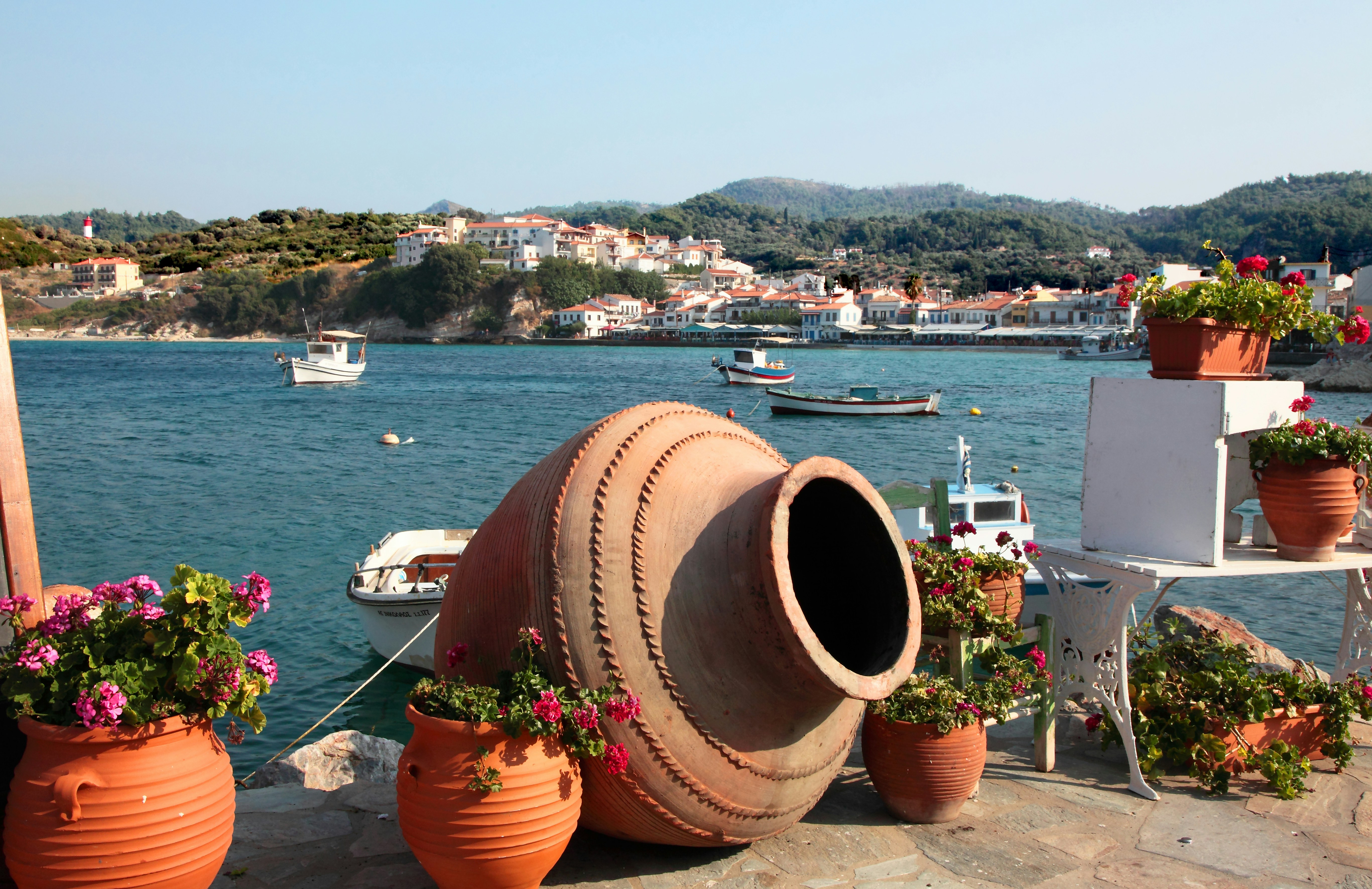 Various articles on the seaside Crepidoma outside of a restaurant.